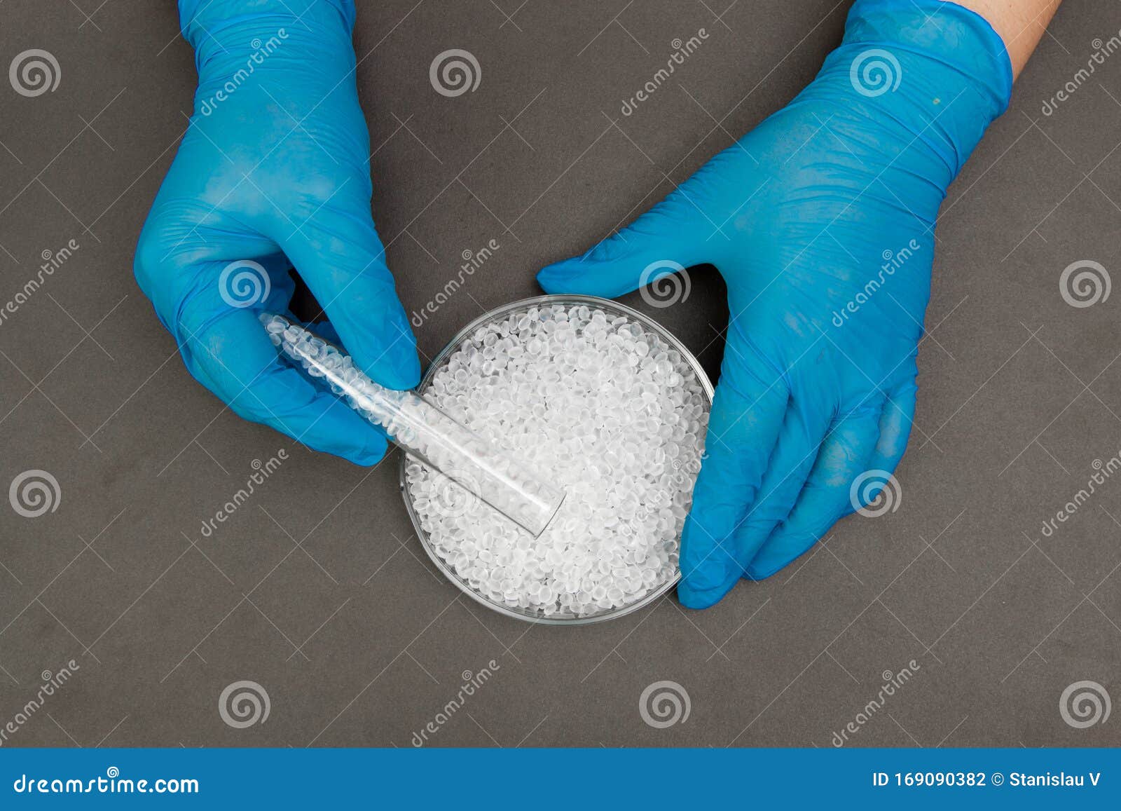 Plastic Granules . Polyethylene Pellets and Hands with Gloves. Quality ...