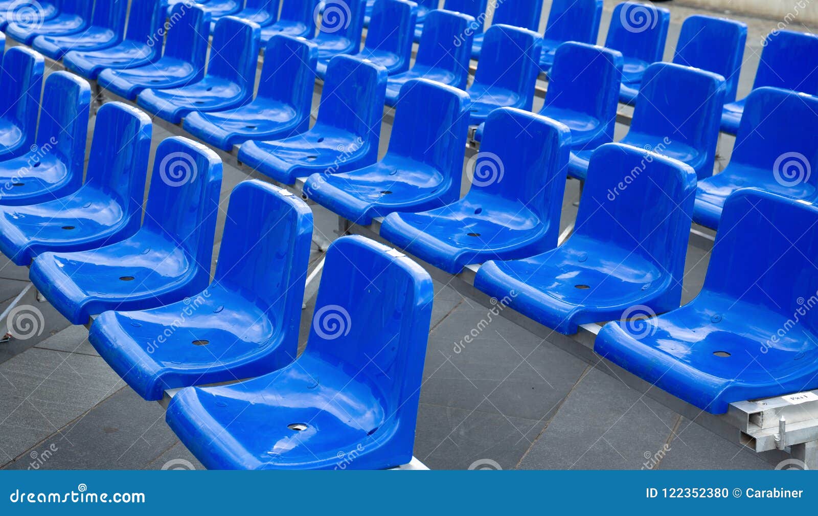 Plastic Hire Chairs in a Row Blue Color Stock Photo - Image of place ...