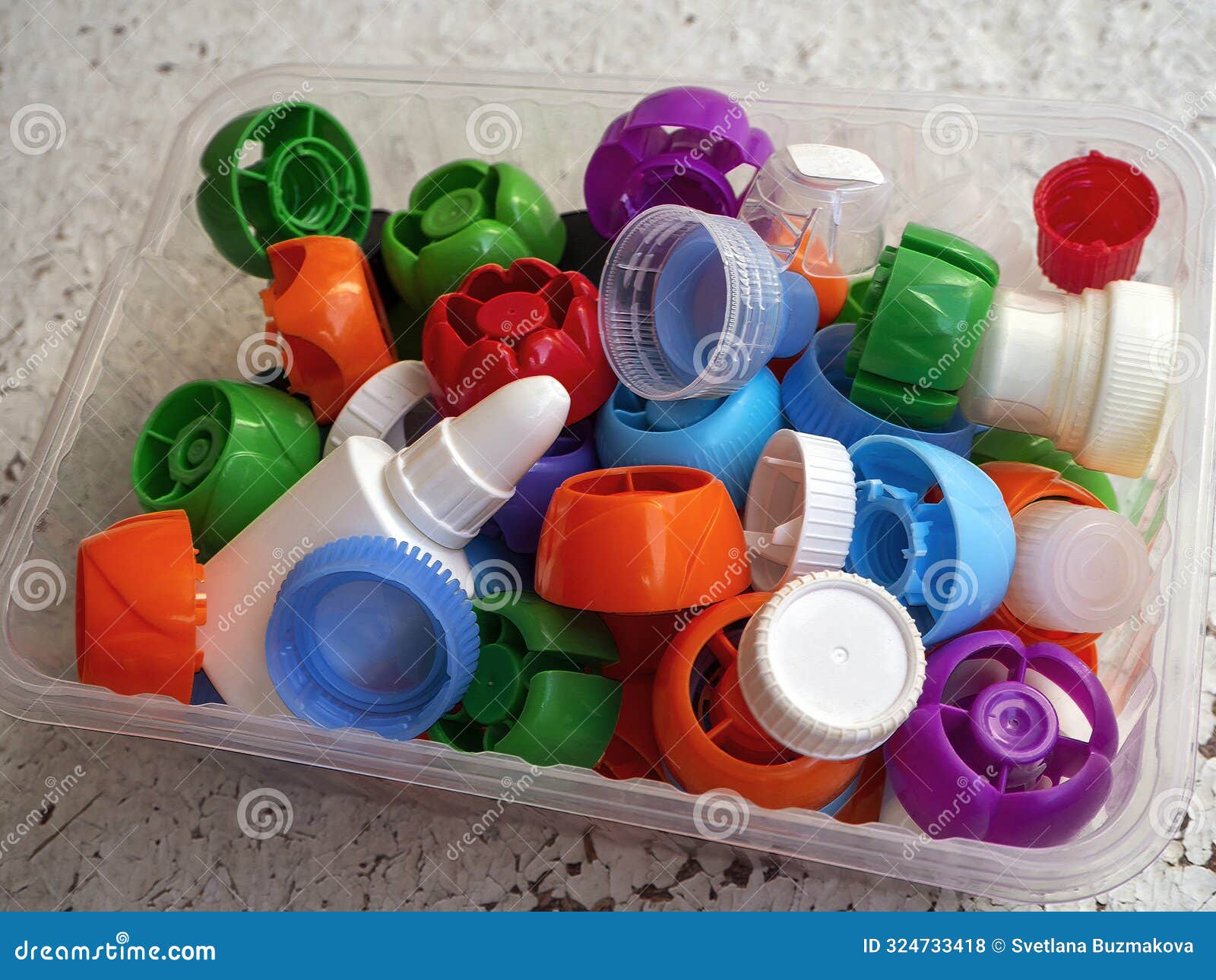 Plastic Lids are Collected in a Box for Recycling. the Concept of ...