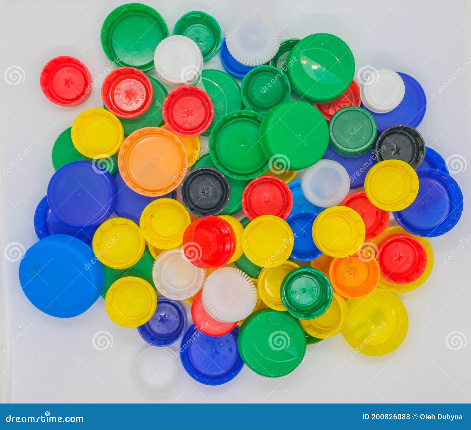 Plastic Lids of Different Colors on a White Background Stock Photo ...