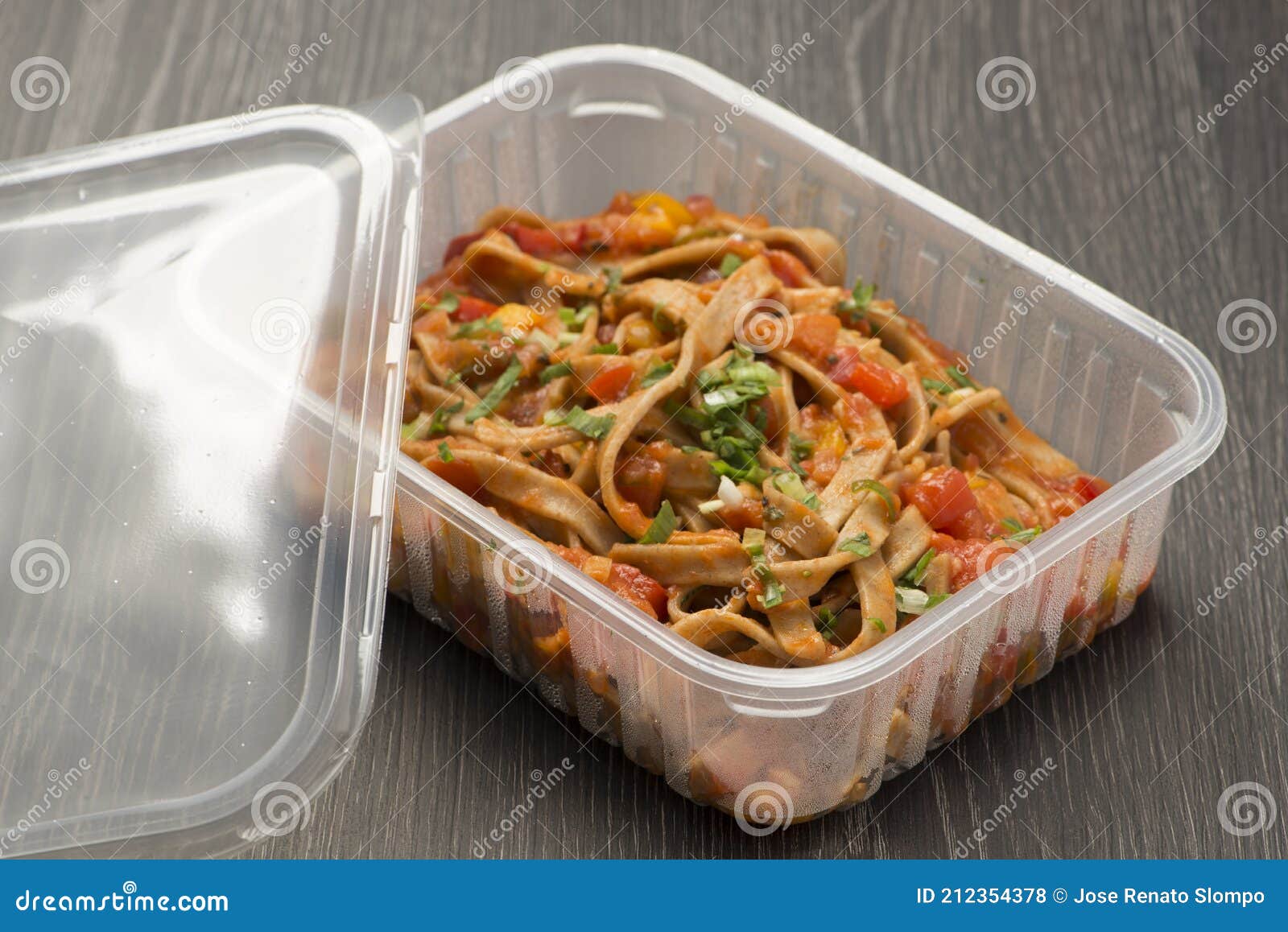 Plastic Lunch Box with Spaghetti with Tomato Sauce and Chives Stock ...