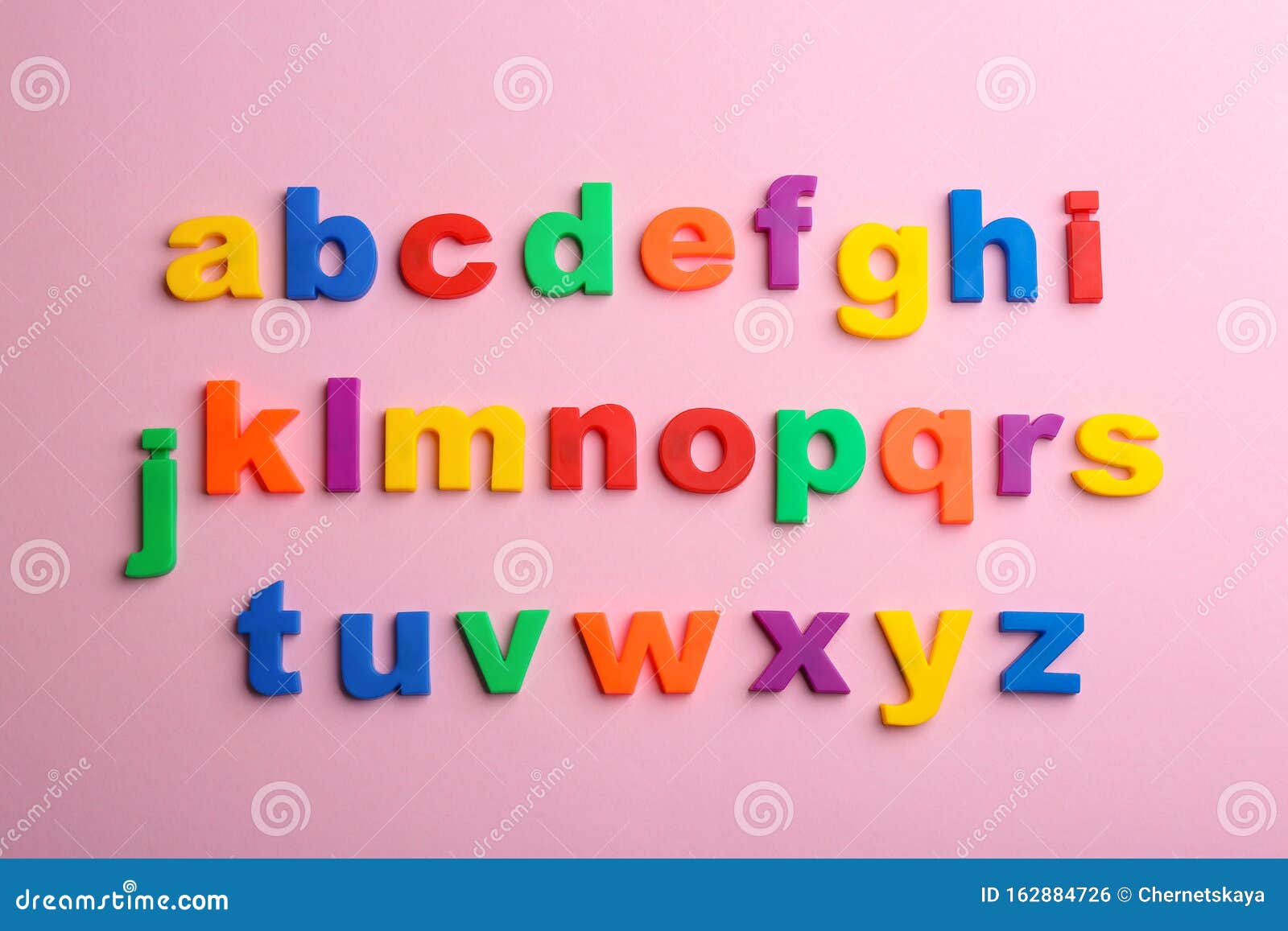 Plastic Magnetic Letters on Pink Background. Alphabetical Order Stock ...