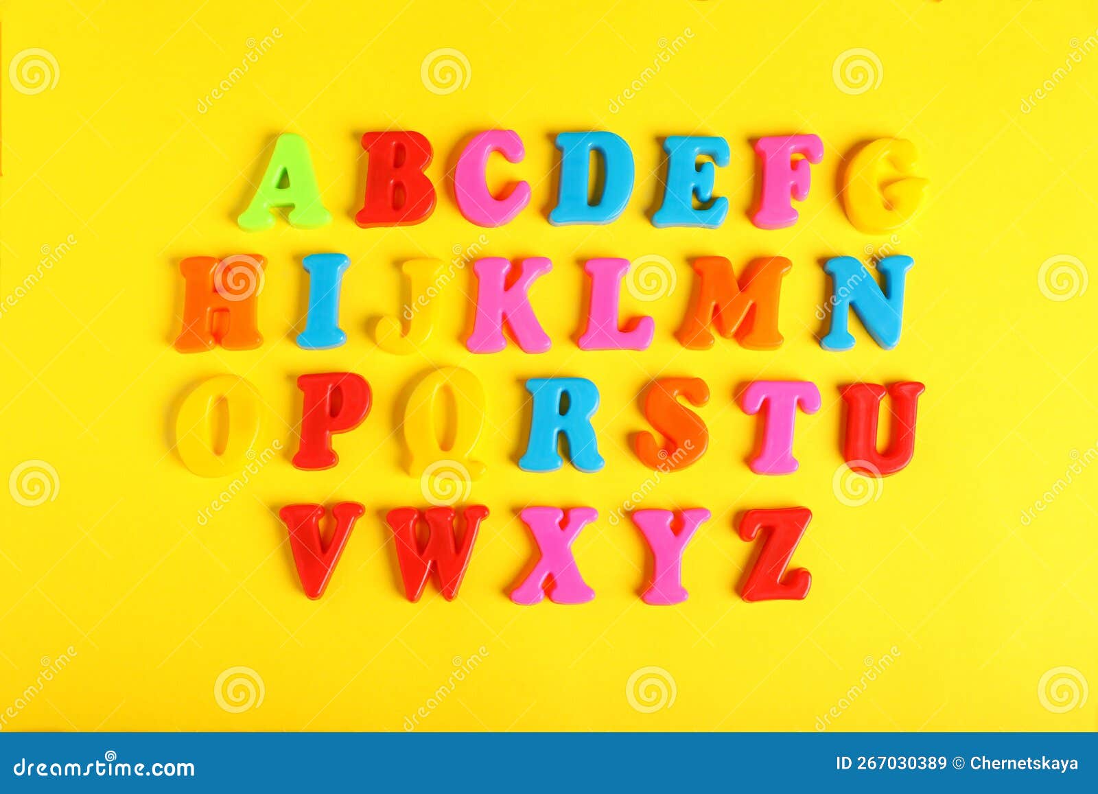 Plastic Magnetic Letters on Yellow Background, Flat Lay. Alphabetical ...