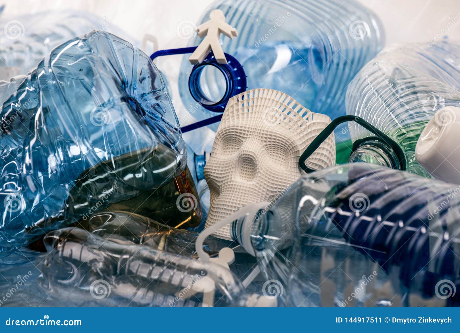 Plastic Models of People and Skull Lying in a Pile of Plastic Garbage ...