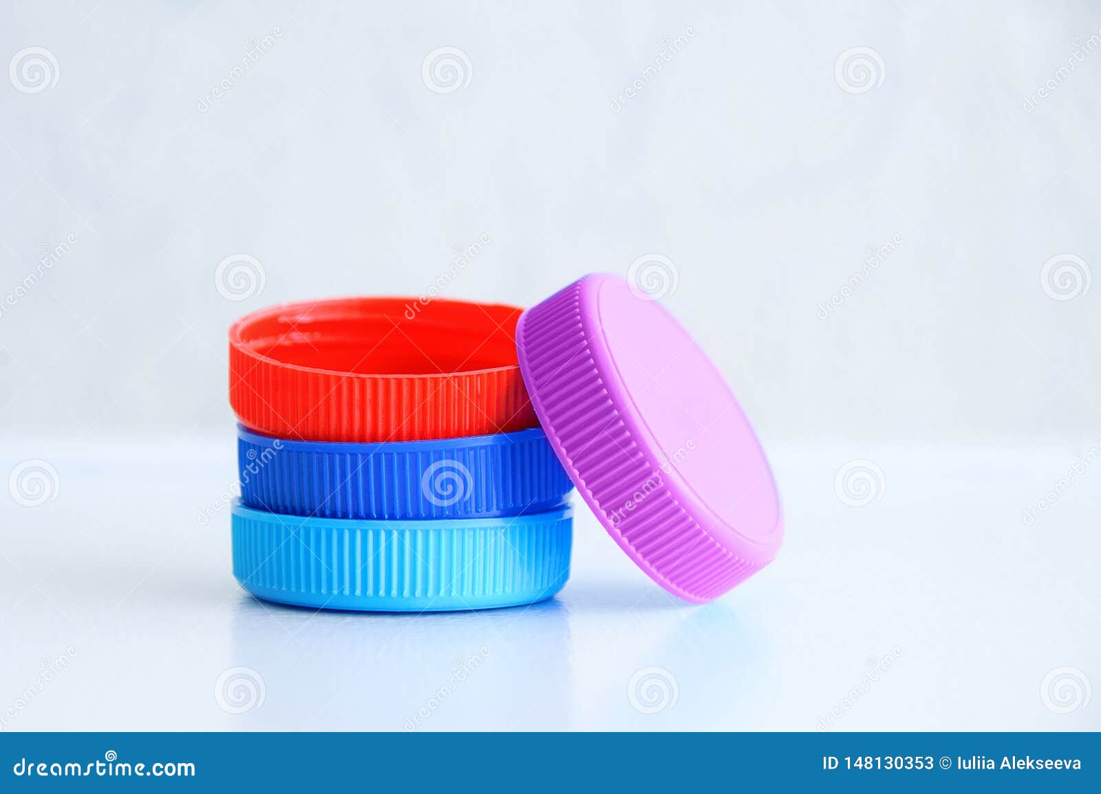 Plastic Multi-colored Bottle Caps on Gray Background. Close-up Stock ...