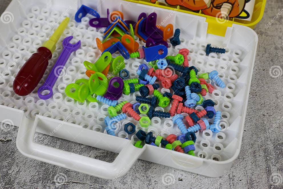 Plastic Multi-colored Cogs and Screws for Child Stock Photo - Image of ...