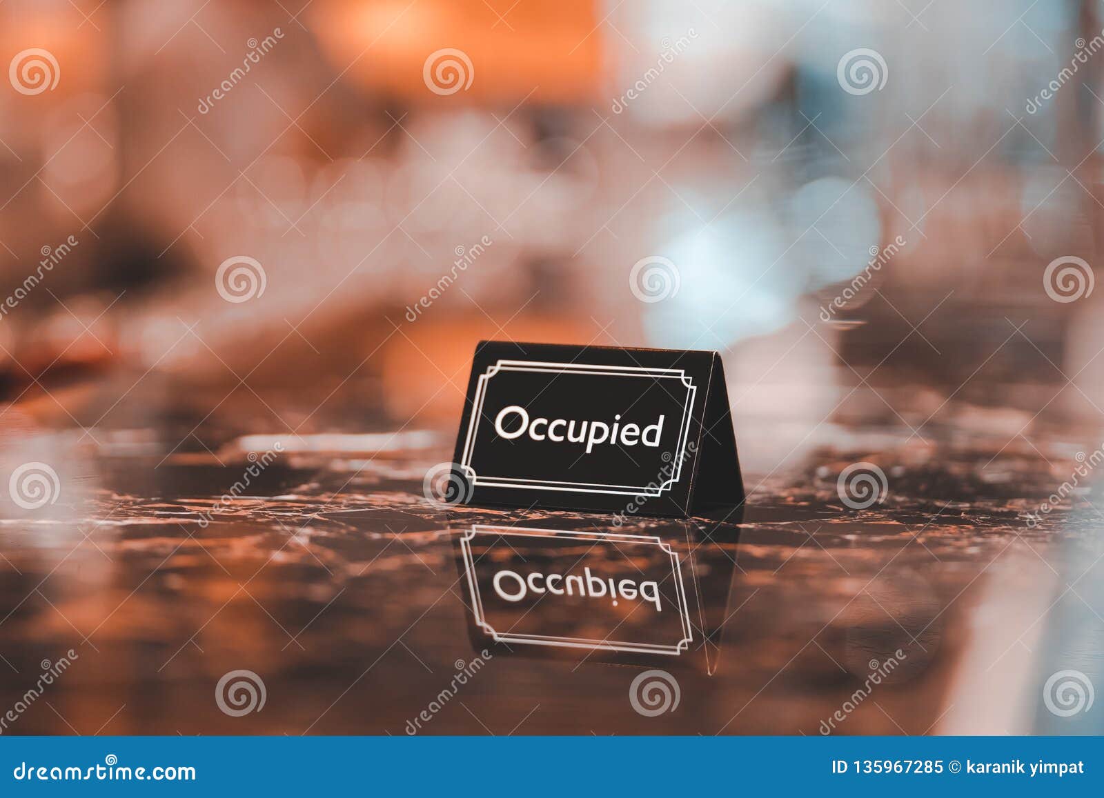 Plastic Occupied Sign with Refection on Dark Marble Dining Table Stock ...
