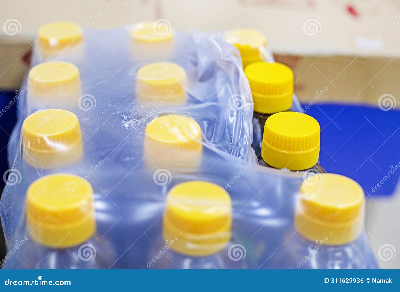 Plastic Packaging with Energy Drinks with Yellow Caps Stock Photo ...