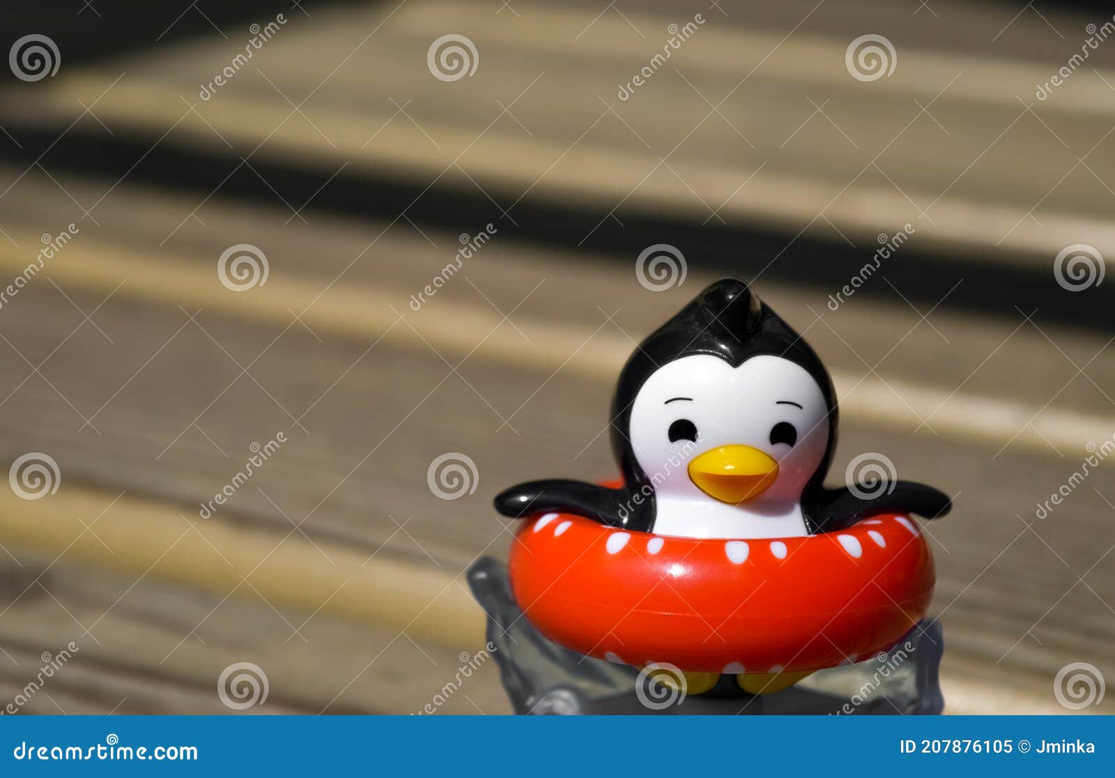 Plastic Penguin Toy with Red Rubber Ring for Swimming Stock Image ...