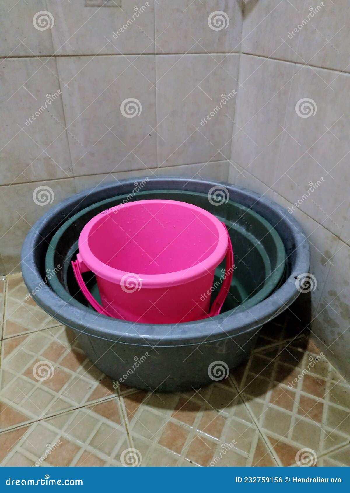 Plastic Pink Bucket in the Plastic Grey Basin. Stock Photo - Image of ...
