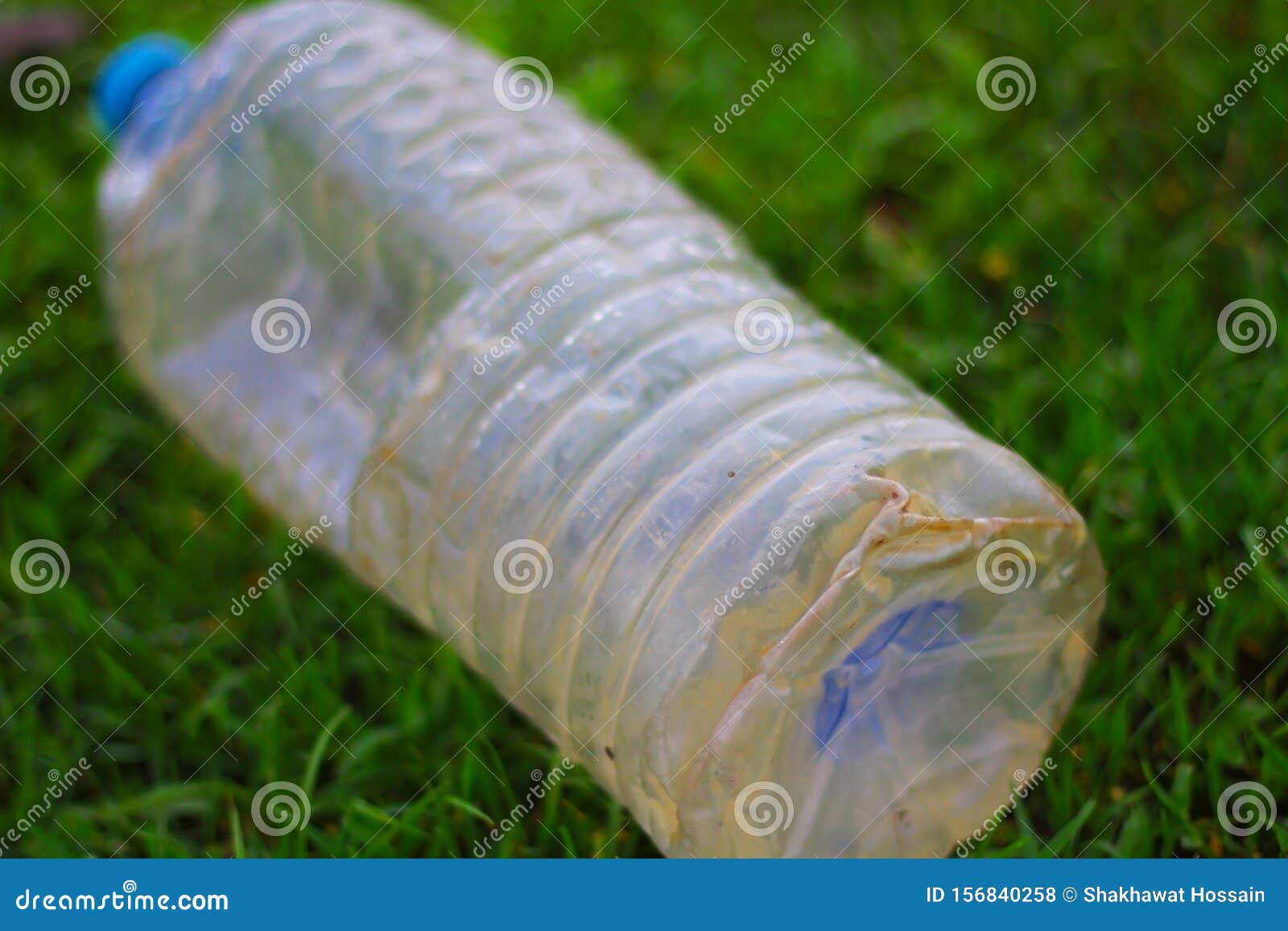 Plastic Pollution - Plastic Bottle is Fallen Down in the Grass Stock ...