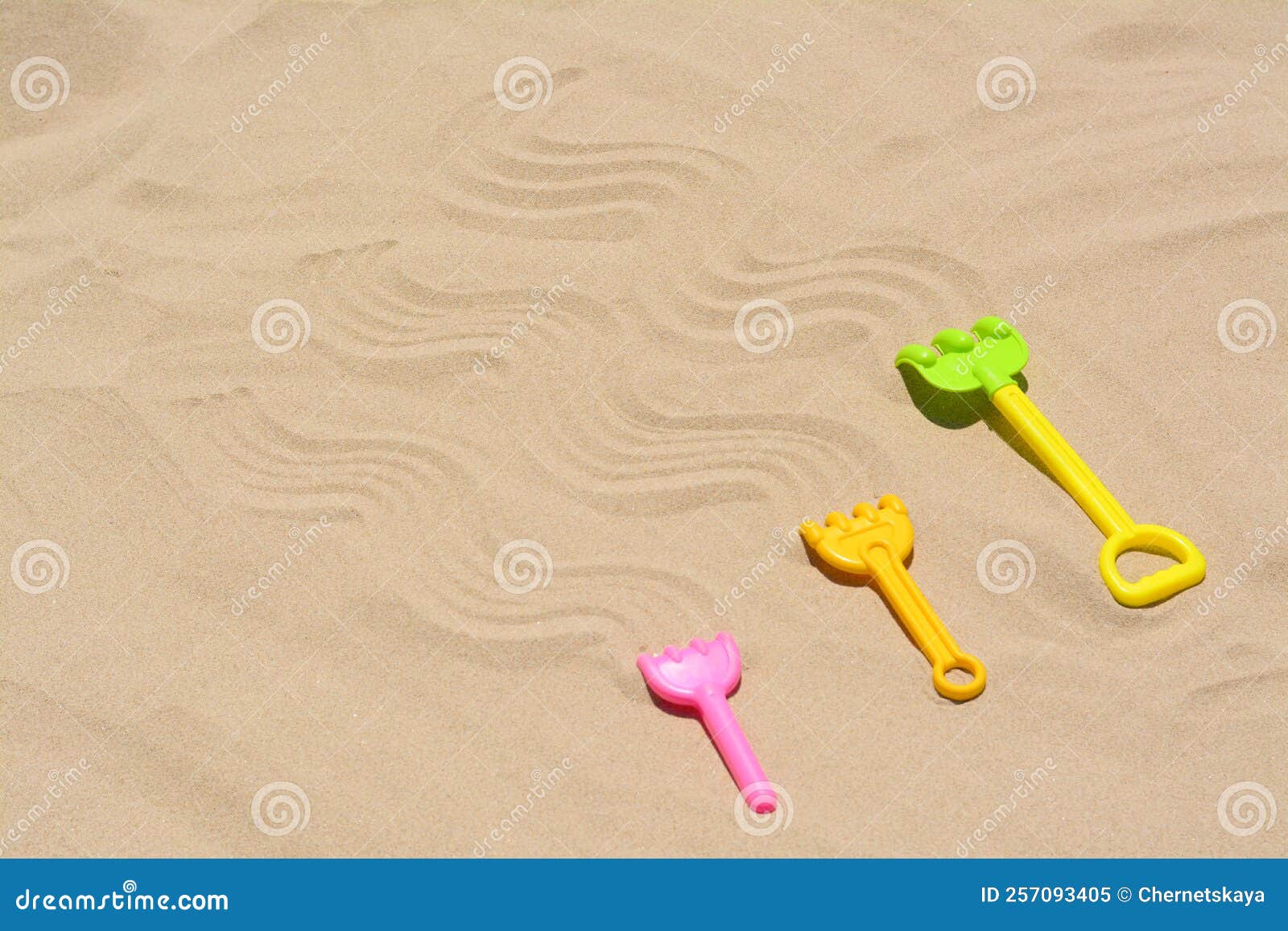 Plastic Rakes on Sand, Space for Text. Beach Toys Stock Image - Image ...
