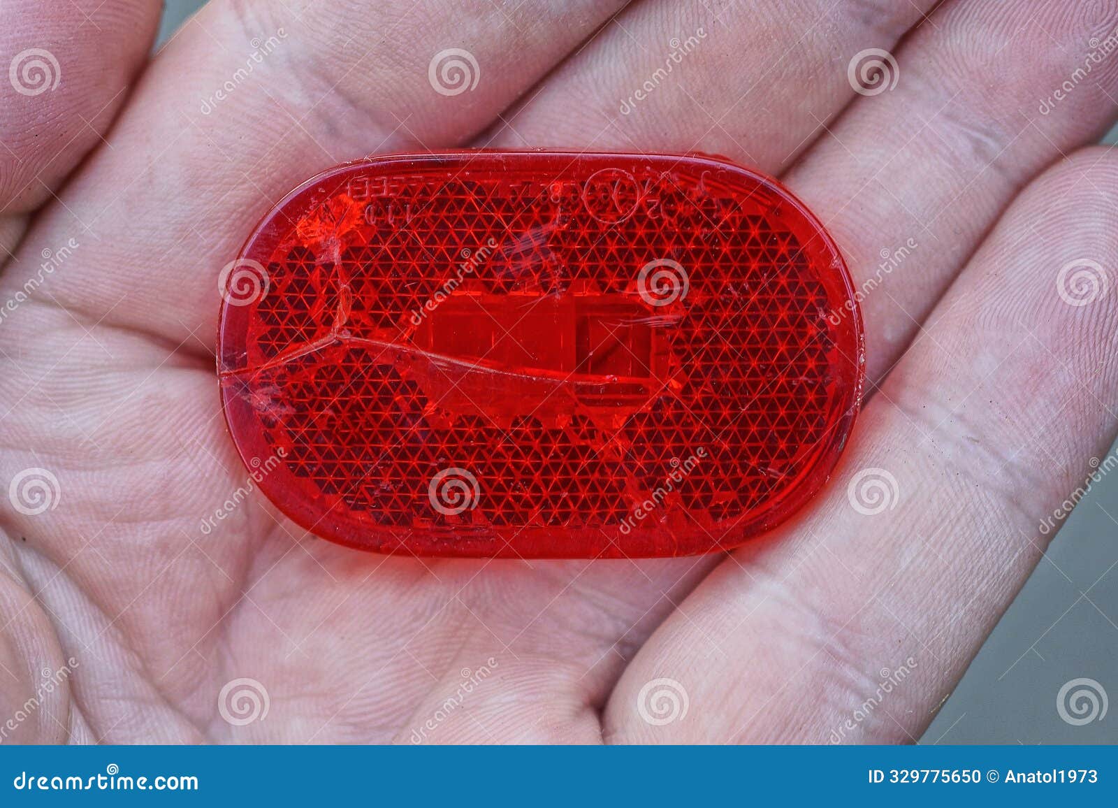 Plastic Red Reflector Lies on the Palm of the Hand Stock Photo - Image ...