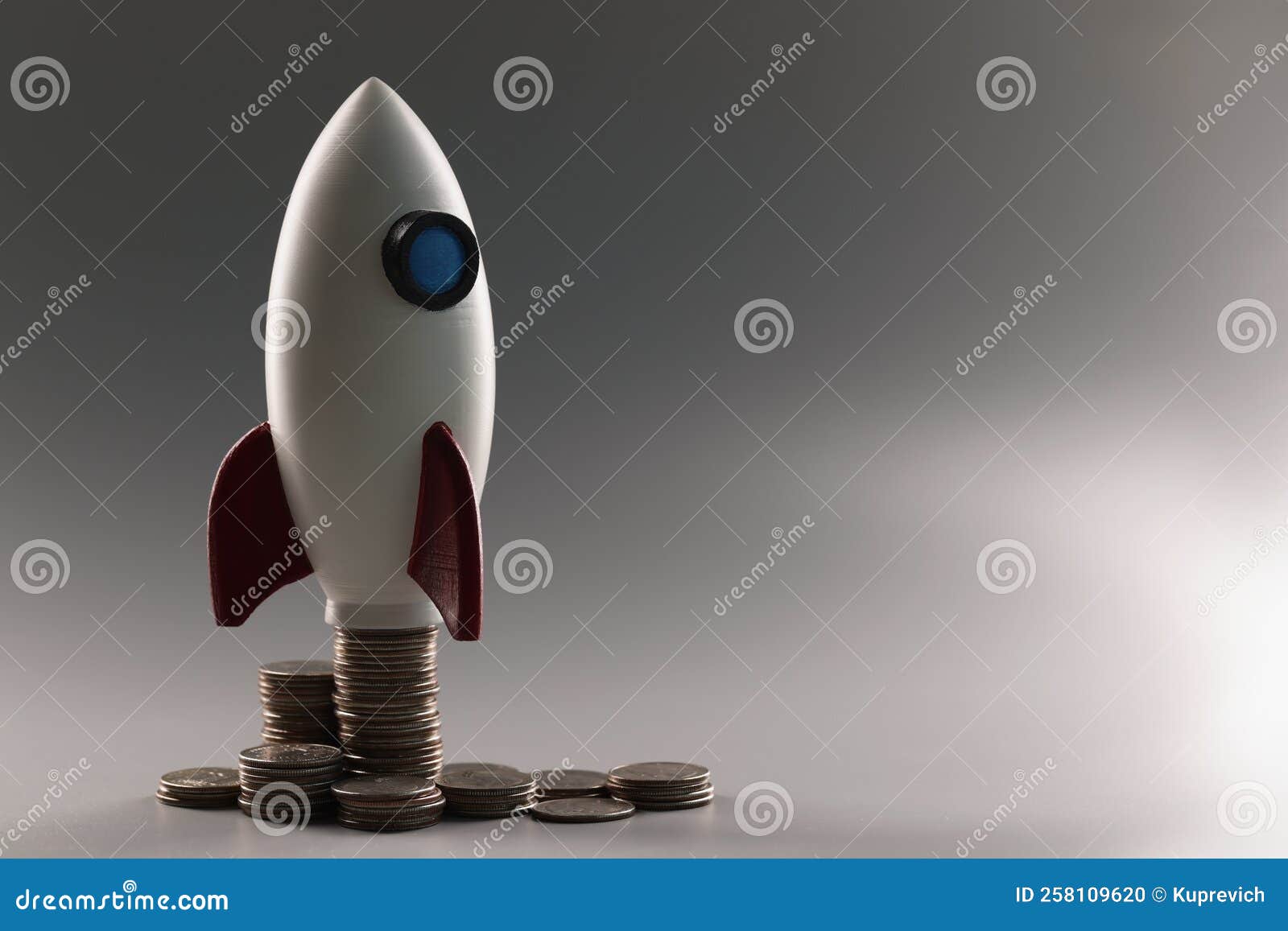 Plastic Rocket on Top of a Stack of Coins, Close-up Stock Photo - Image ...