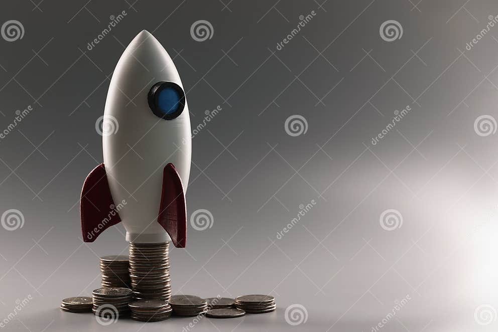 Plastic Rocket on Top of a Stack of Coins, Close-up Stock Photo - Image ...