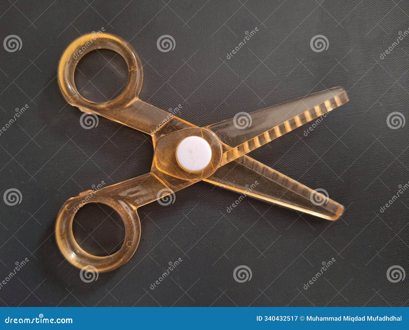 Plastic Scissors for Cutting Paper in Jagged Patterns. with a Dark Gray ...