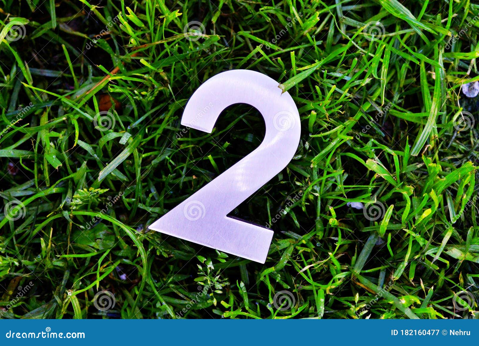 Plastic Shining Number Two on a Grass Stock Image - Image of view ...