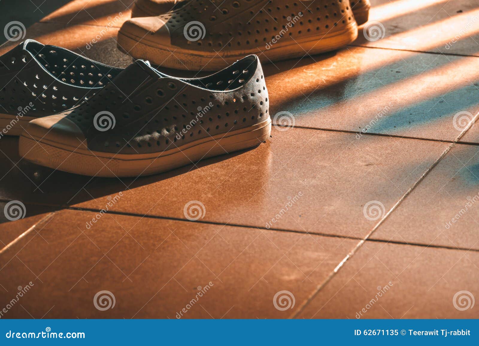 Plastic Shoes on Tile Background with Copy Space Stock Image - Image of ...