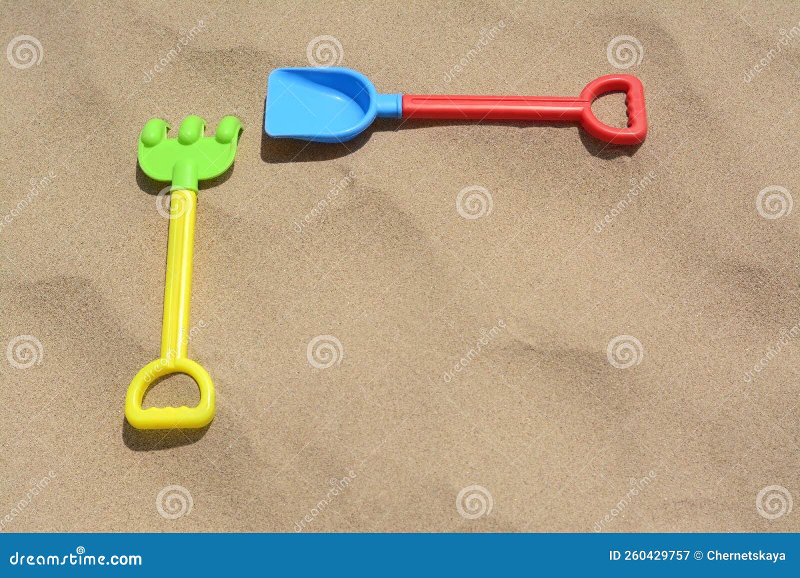 Plastic Shovel and Rake on Sand, Space for Text. Beach Toys Stock Image ...