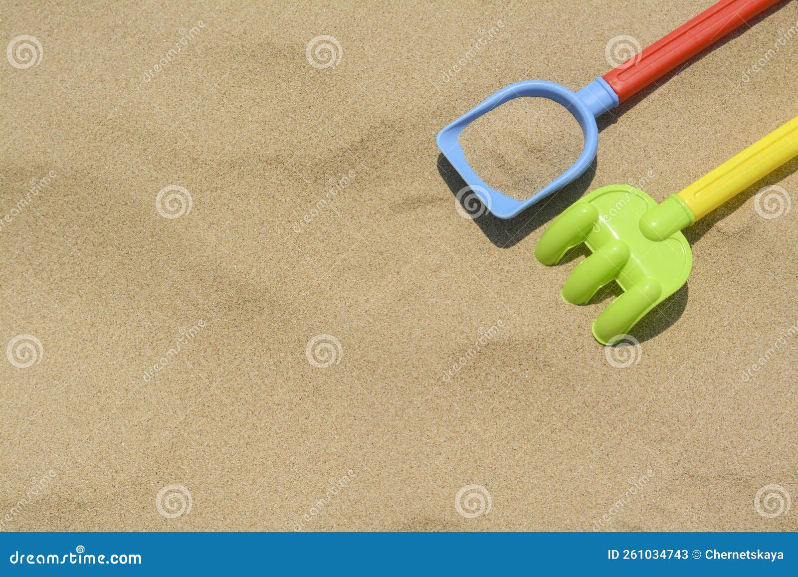 Plastic Shovel and Rake on Sand, Space for Text. Beach Toys Stock Image ...