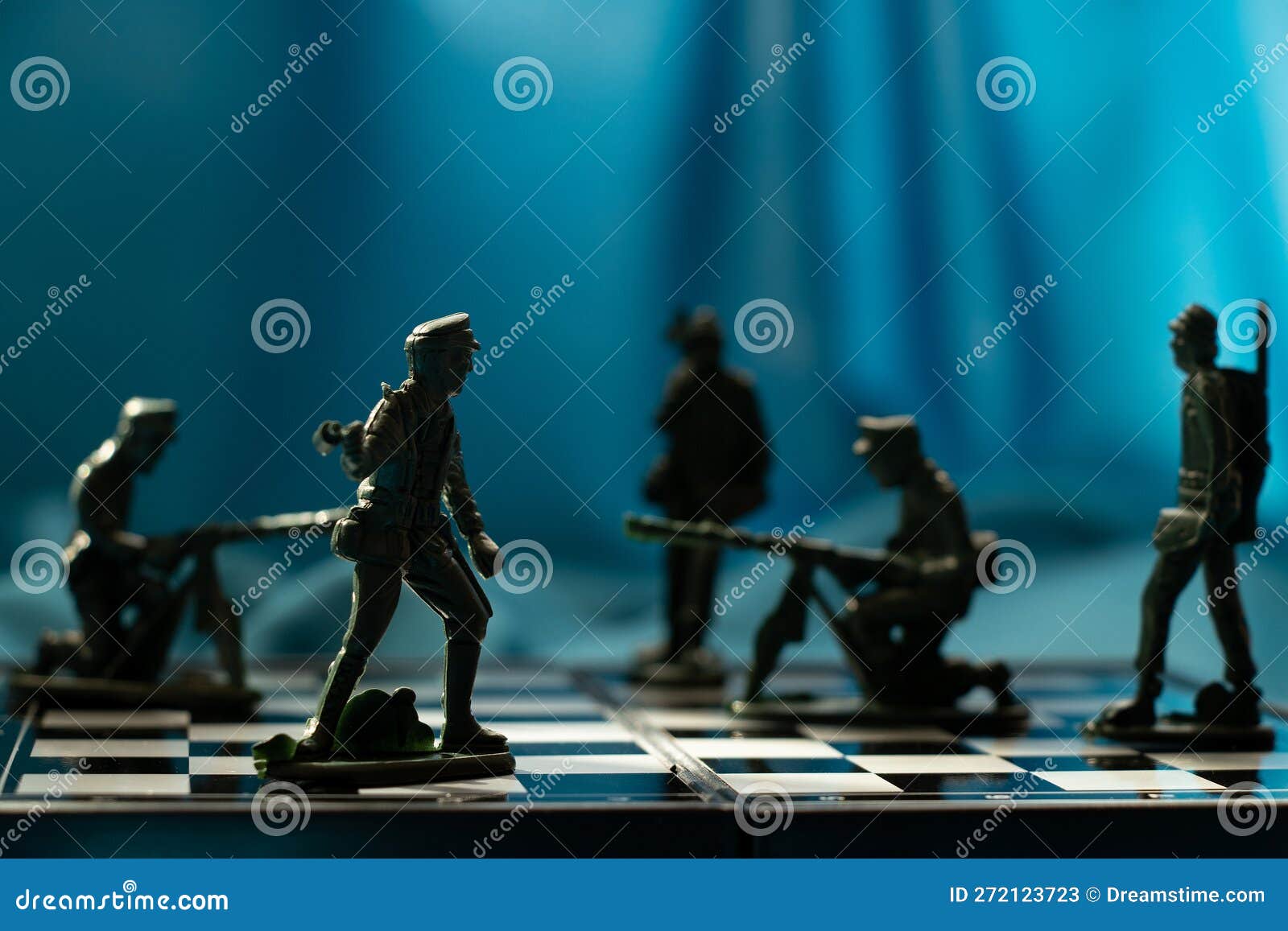 Plastic Soldiers Stand on a Chessboard in the Dark on a Blue Background ...