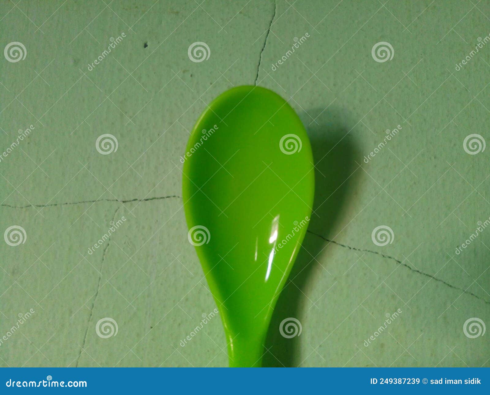 Plastic Spoon on the Cracked Wall Stock Image - Image of green, cracked ...