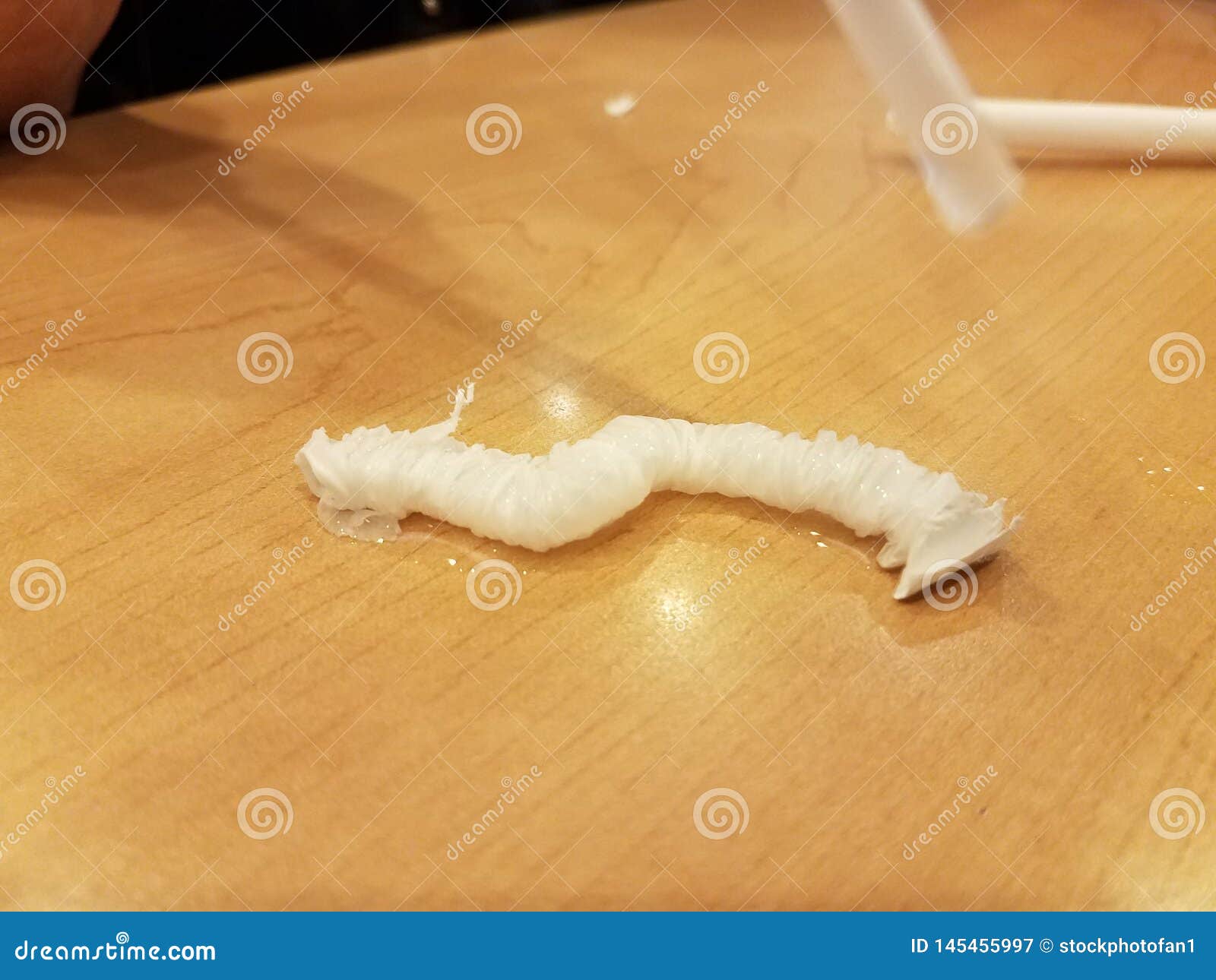 Plastic Straw and Wet Paper Straw Cover on Brown Wood Table Stock Image ...