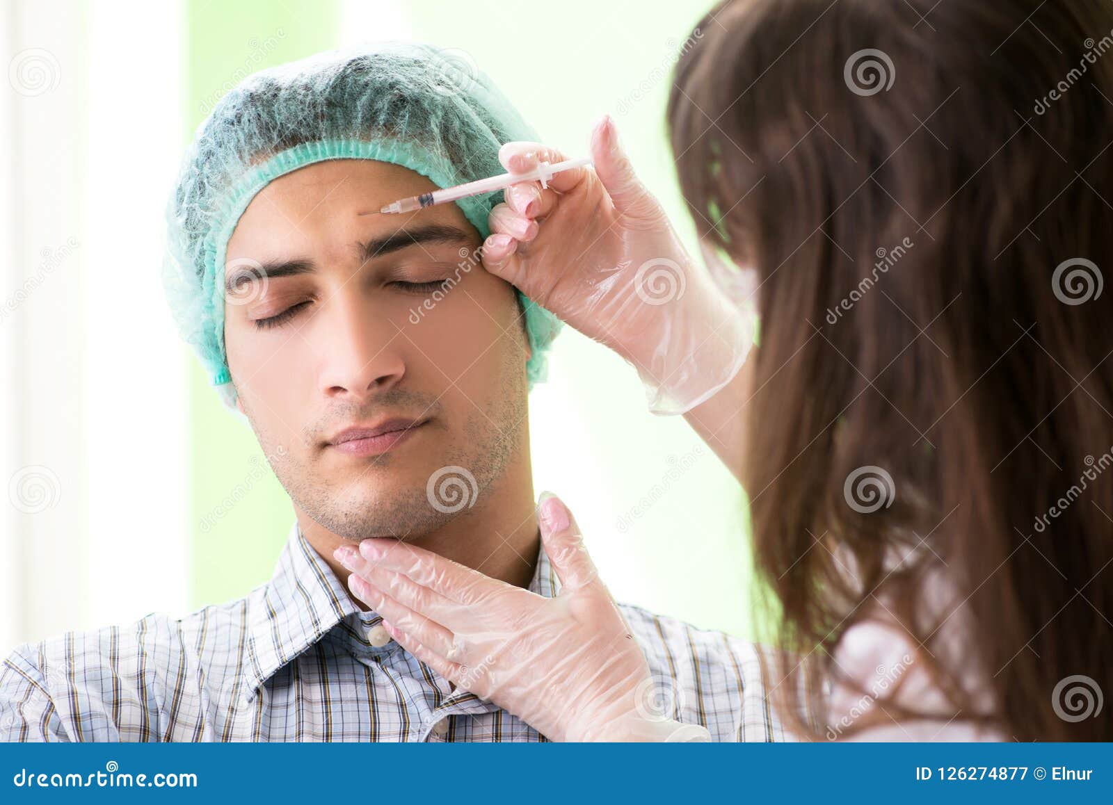The Plastic Surgeon Preparing for Operation on Man Face Stock Image ...