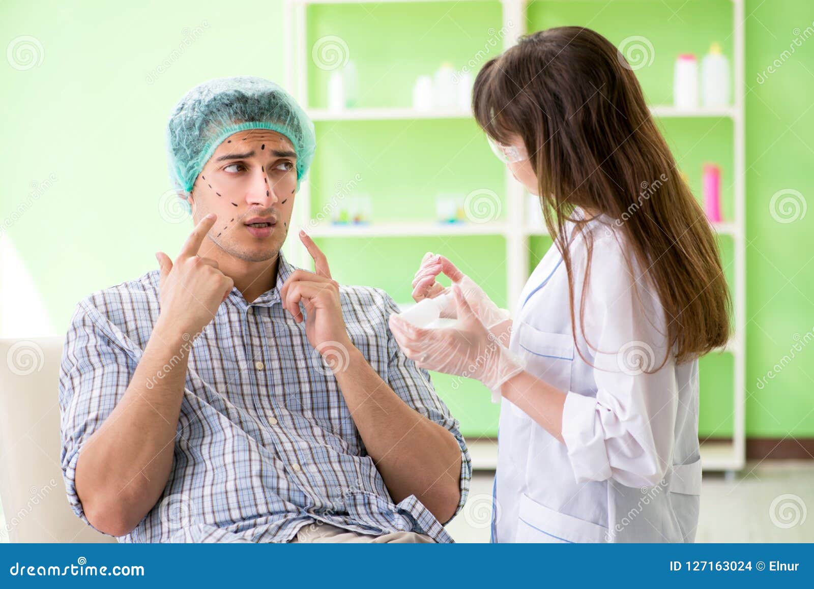 The Plastic Surgeon Preparing for Operation on Man Face Stock Photo ...