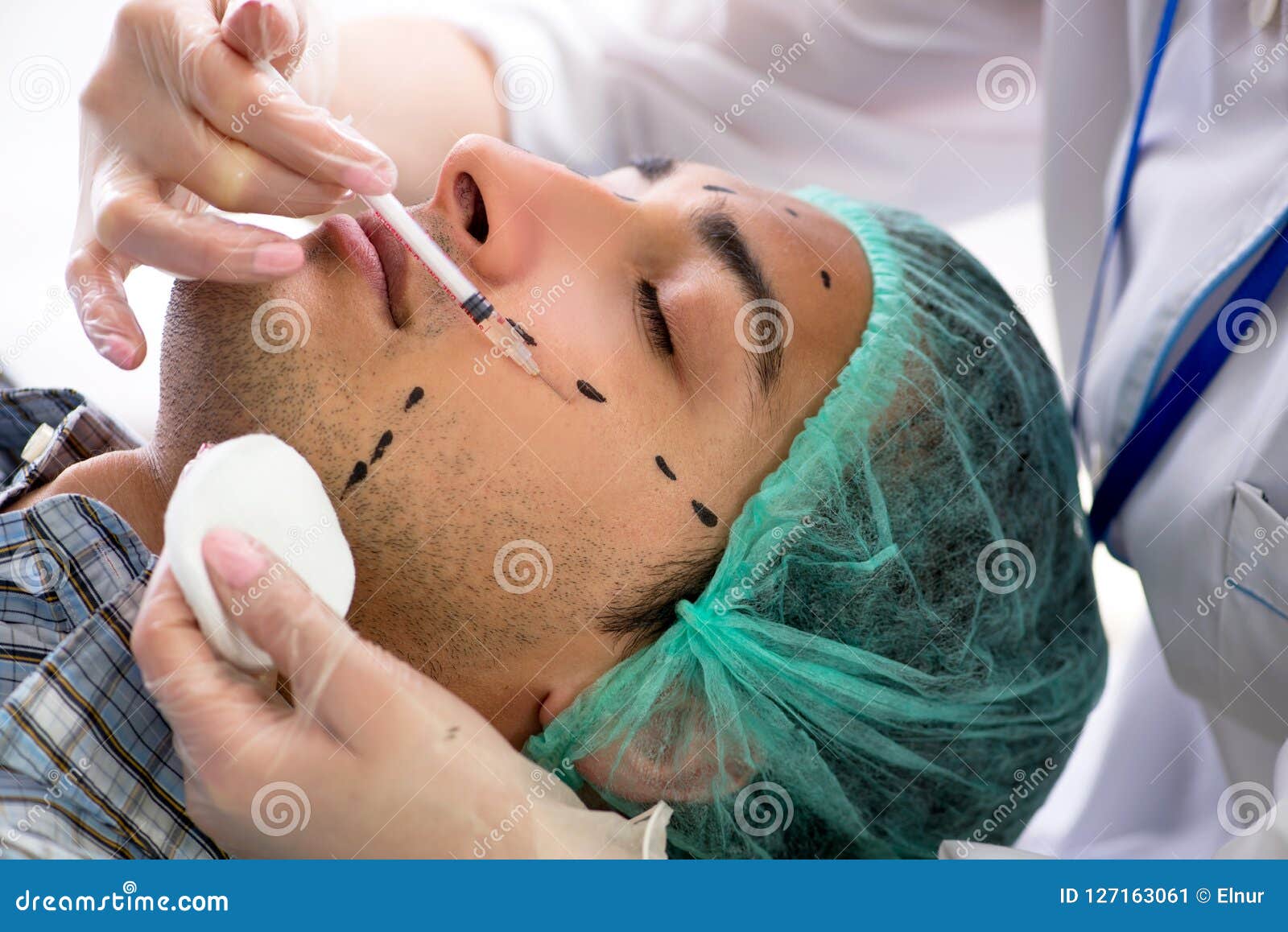 The Plastic Surgeon Preparing for Operation on Man Face Stock Image ...