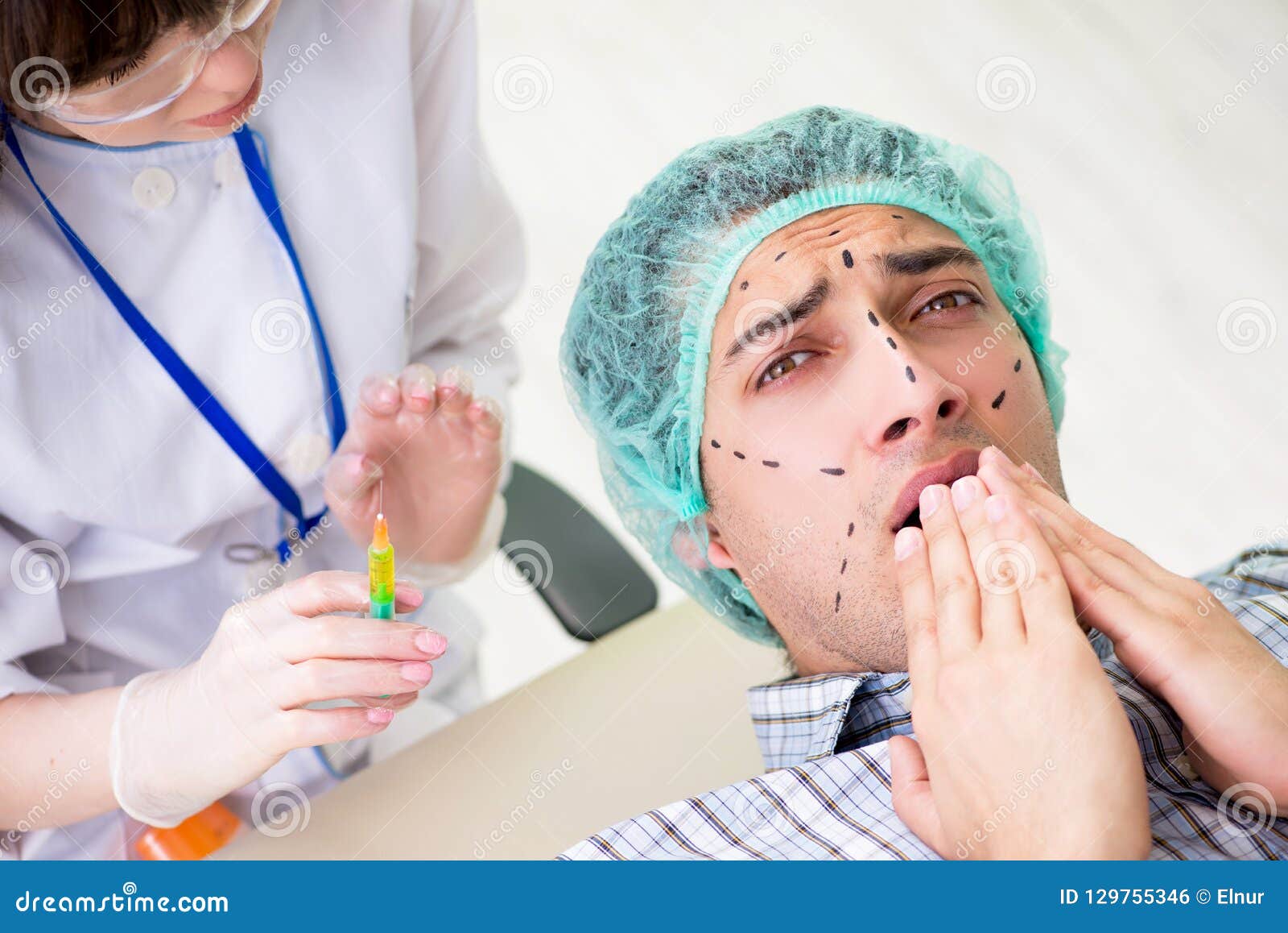 The Plastic Surgeon Preparing for Operation on Man Face Stock Photo ...