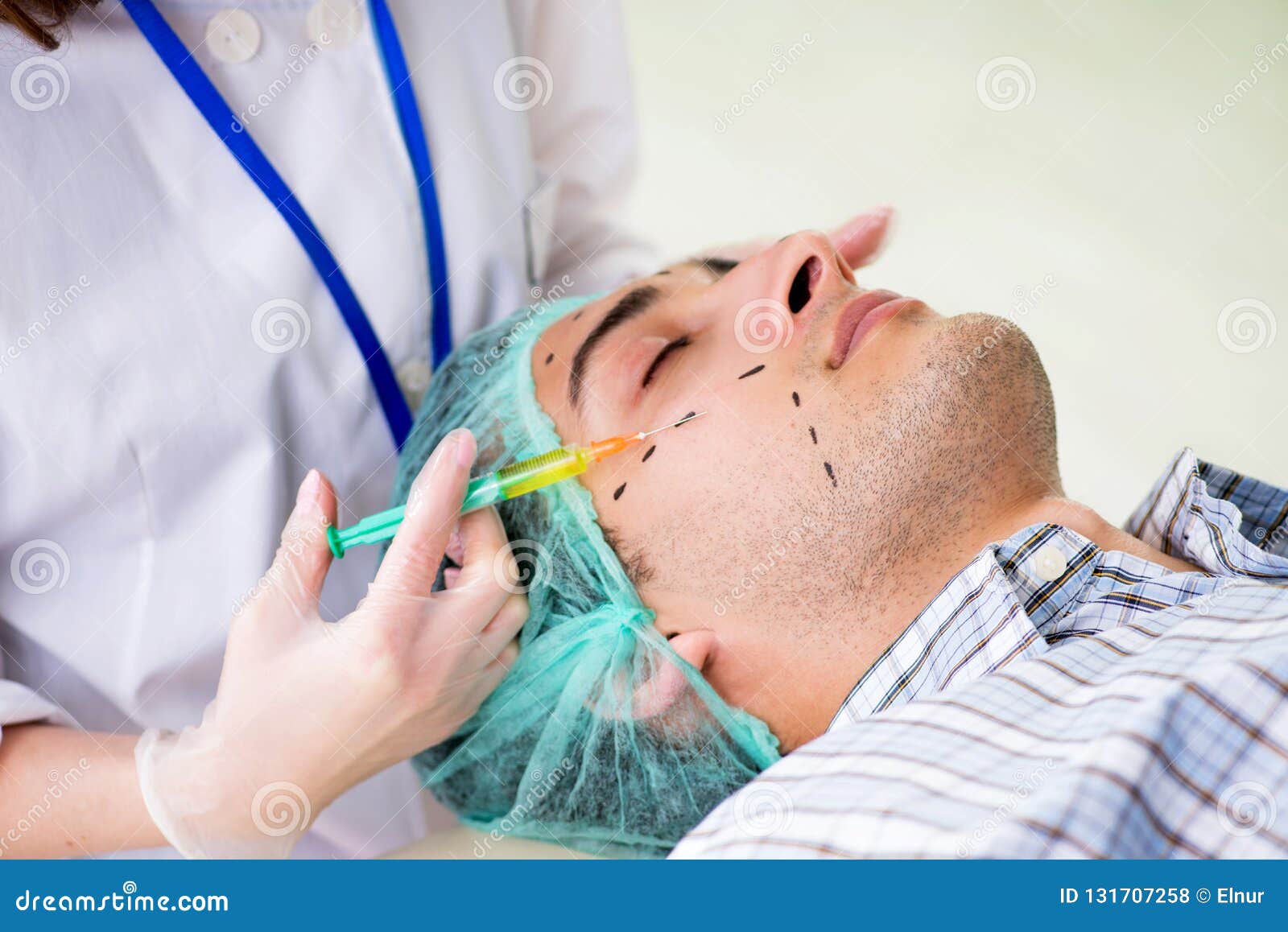 The Plastic Surgeon Preparing for Operation on Man Face Stock Photo ...