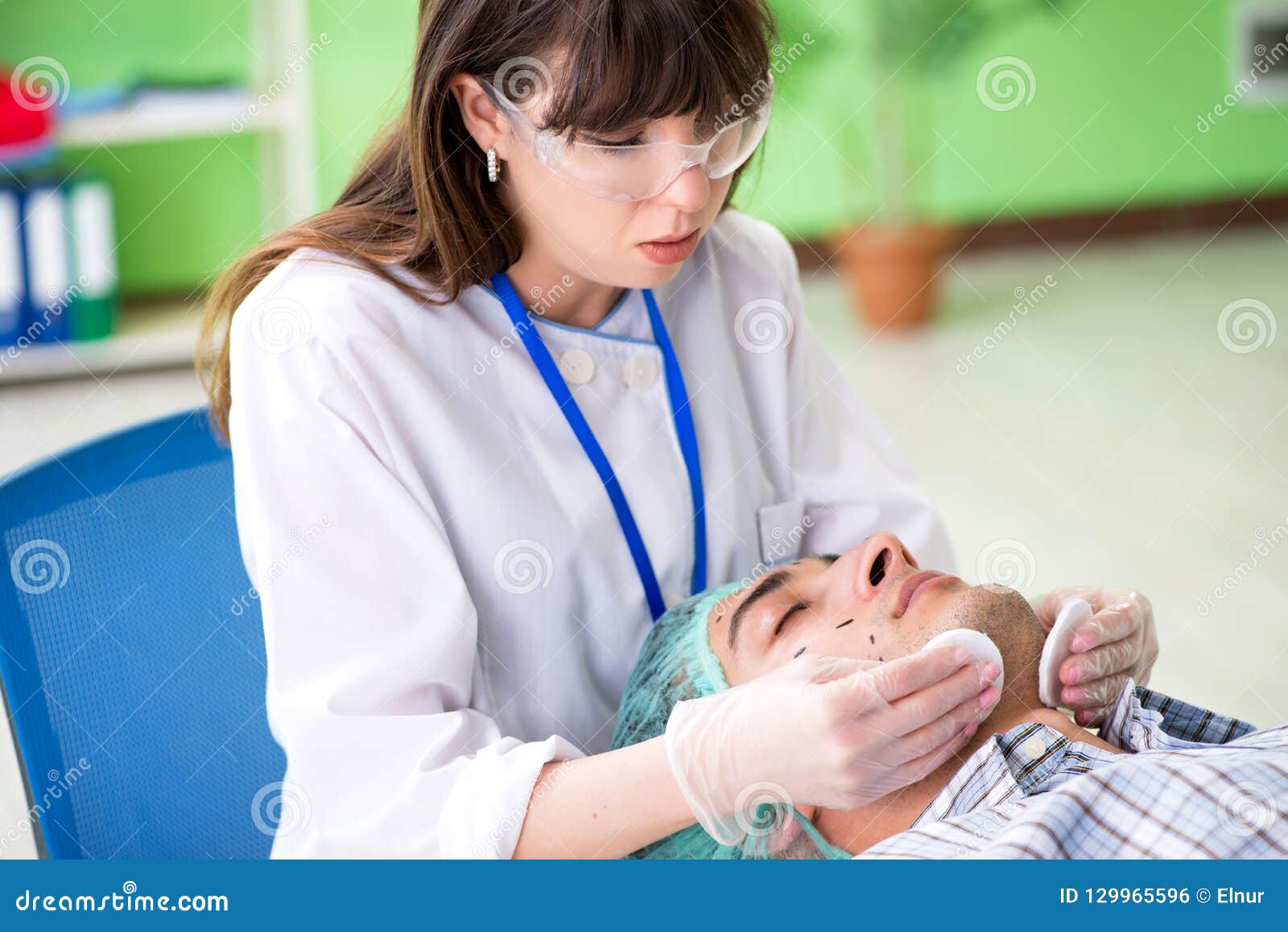 The Plastic Surgeon Preparing for Operation on Man Face Stock Photo ...