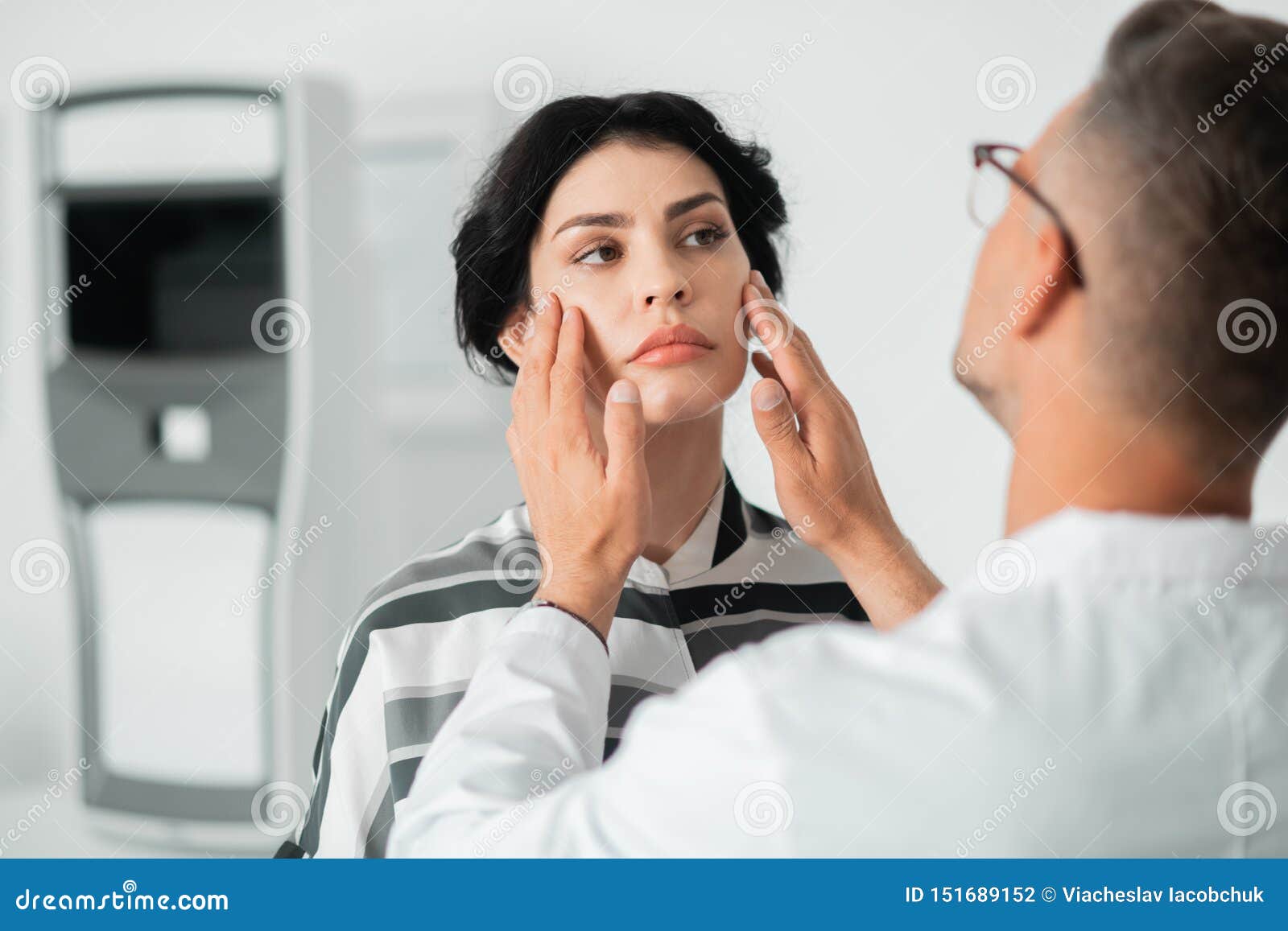 Plastic Surgeon Putting Hands on Face while Examining before Surgery ...