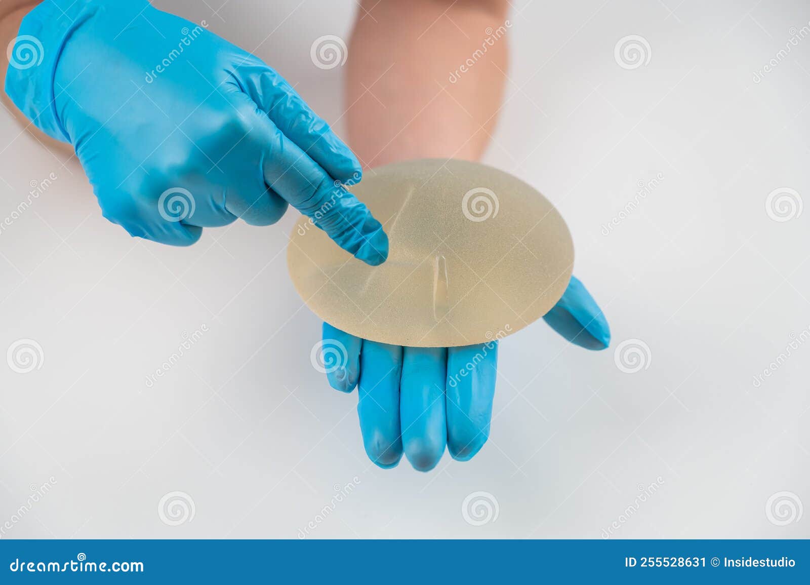 A Plastic Surgeon Shows a Breast Silicone Implant. Stock Image - Image ...