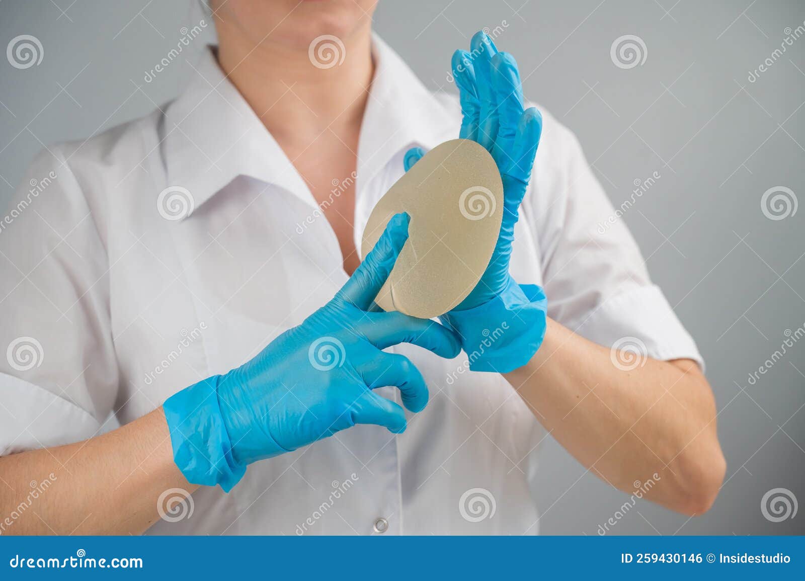 A Plastic Surgeon Shows a Breast Silicone Implant. Stock Photo - Image ...