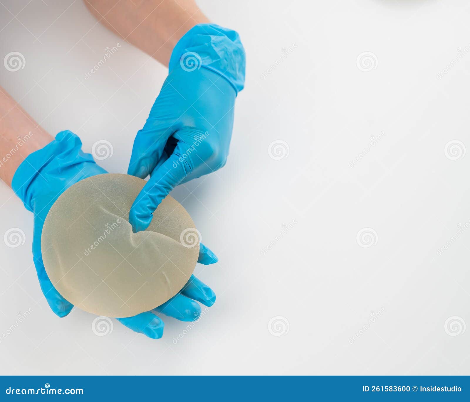 A Plastic Surgeon Shows a Breast Silicone Implant. Stock Photo - Image ...