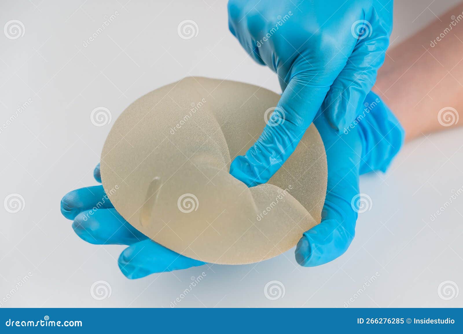 A Plastic Surgeon Shows a Breast Silicone Implant. Stock Image - Image ...