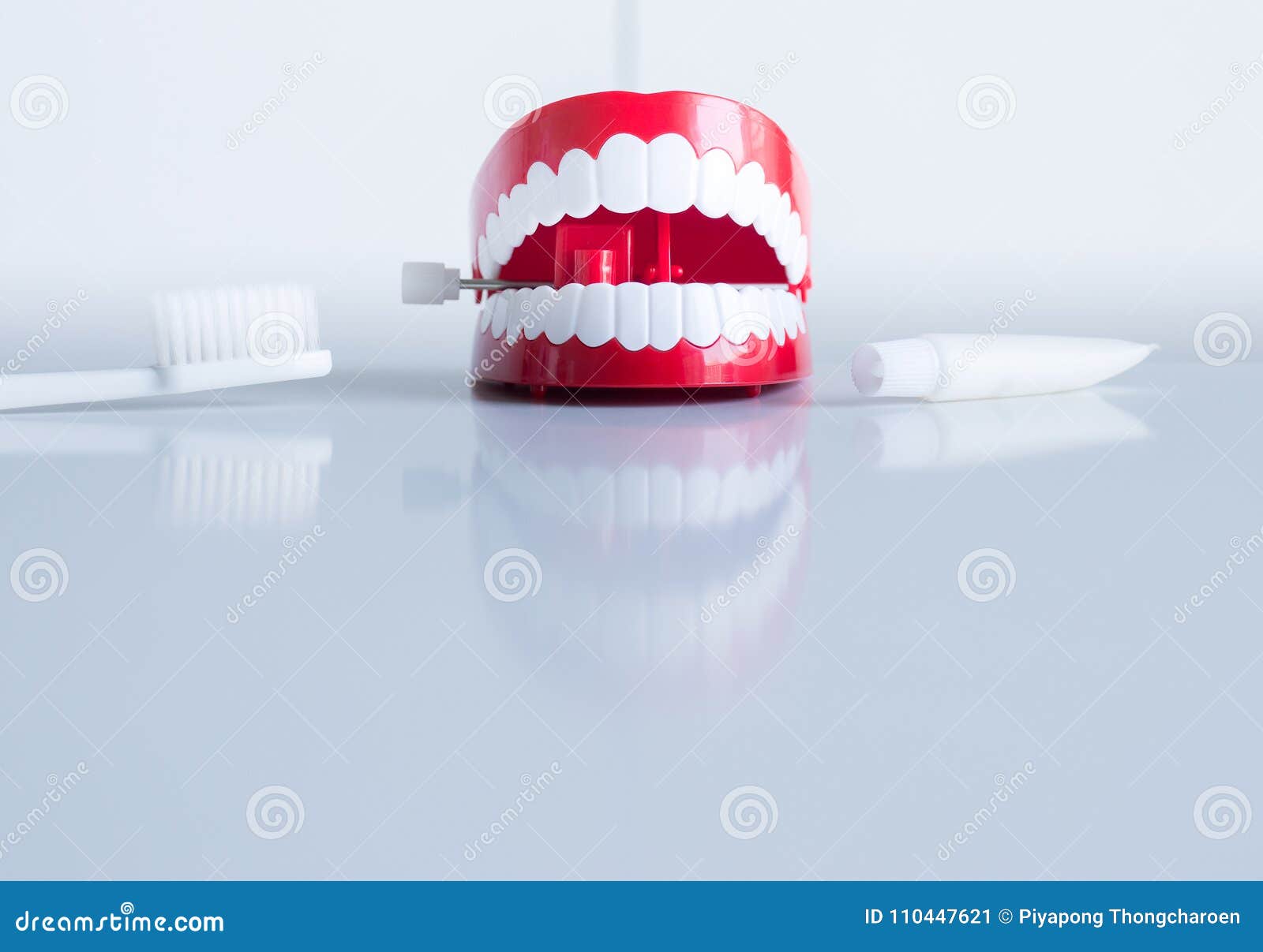Plastic Teeth Models with Toothbrush and Toothpaste Stock Image - Image ...