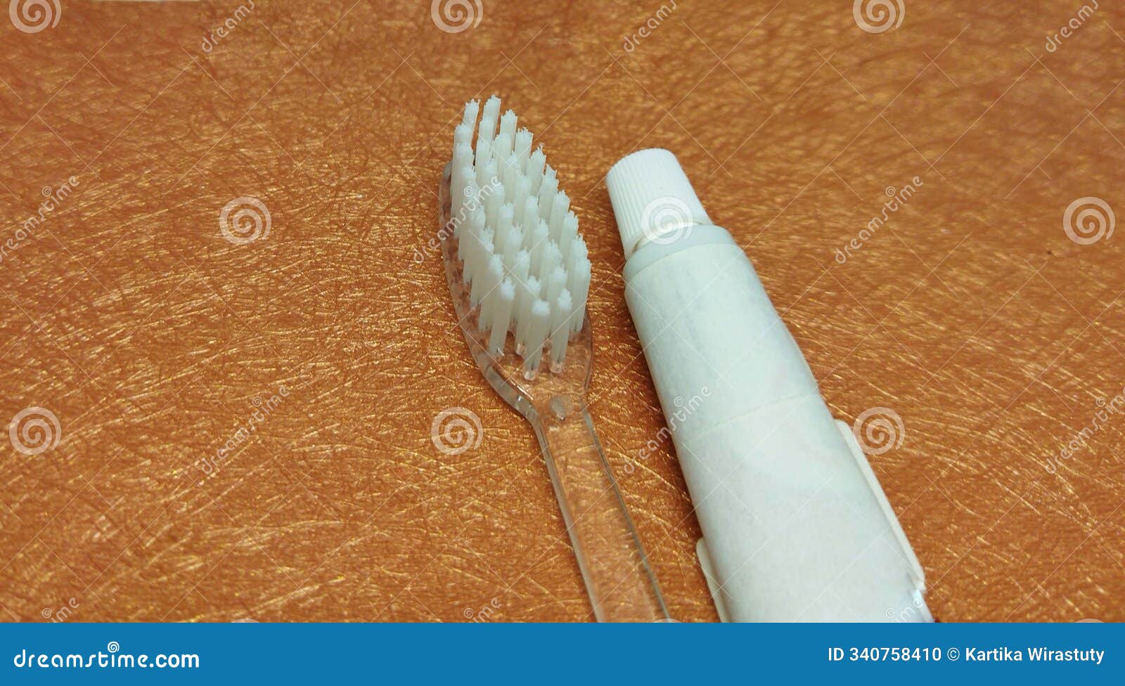 Plastic Toothbrush and Small Toothpaste from Hotel Amenities Isolated ...