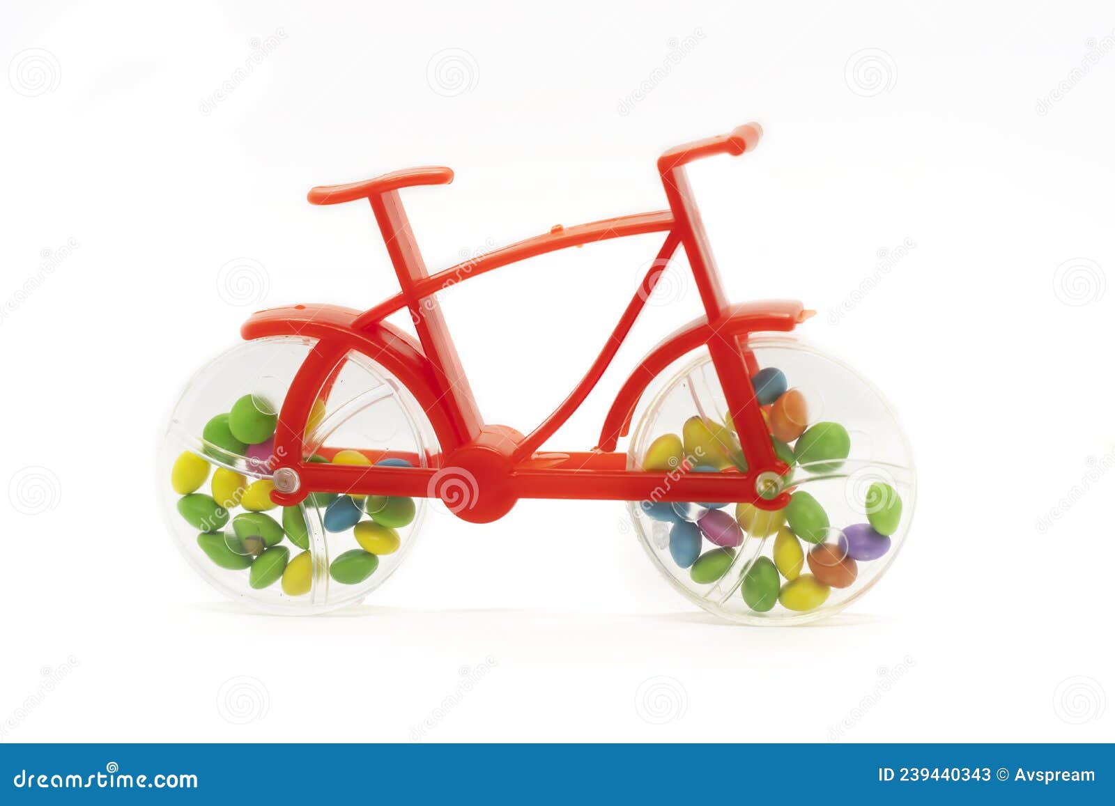 Plastic Toy Bicycle with Chocolate Nut Candy Inside the Bicycle Wheel ...