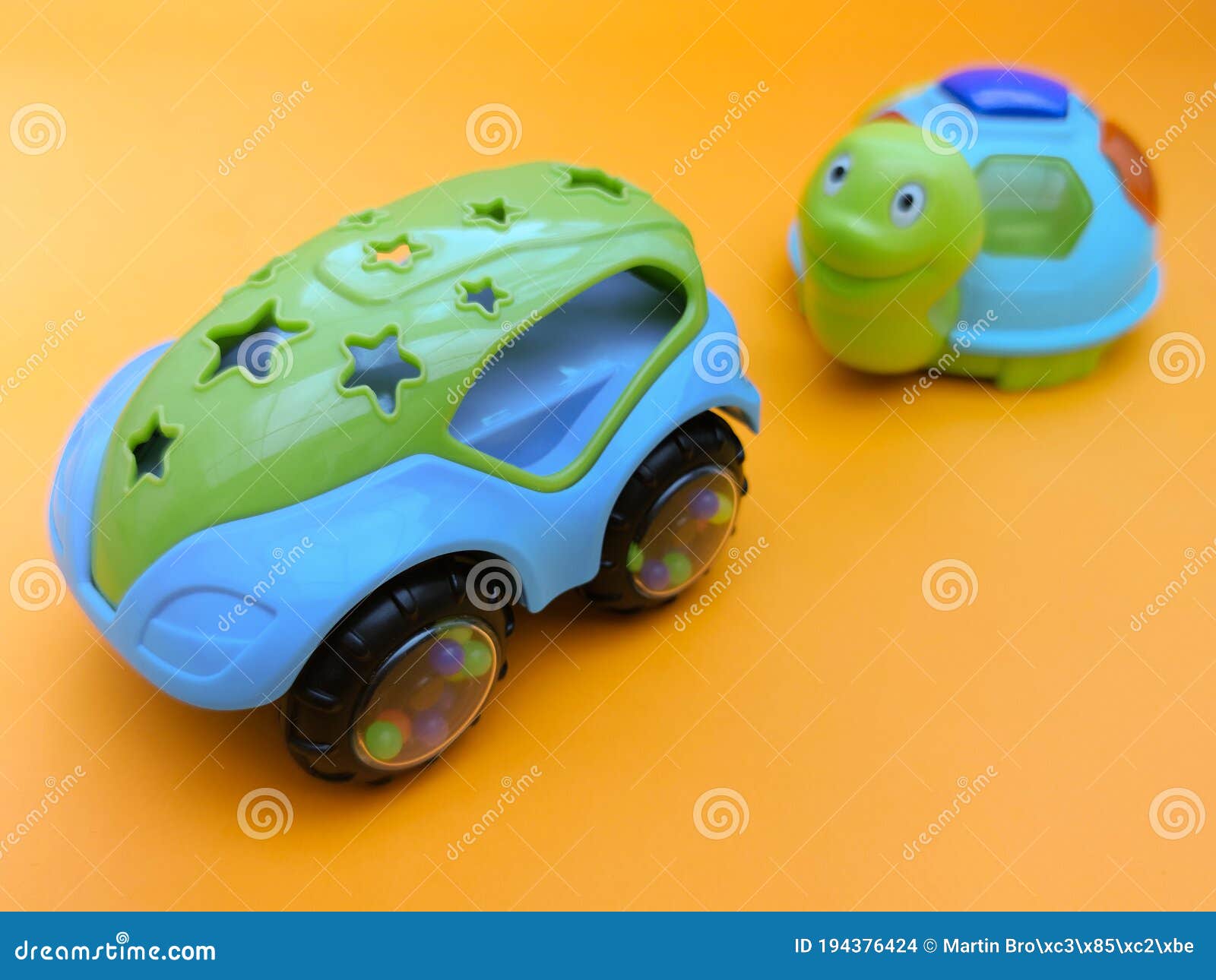 Plastic Toy Blue Car, Turtle, Fast Car Overtakes, on Orange Background ...