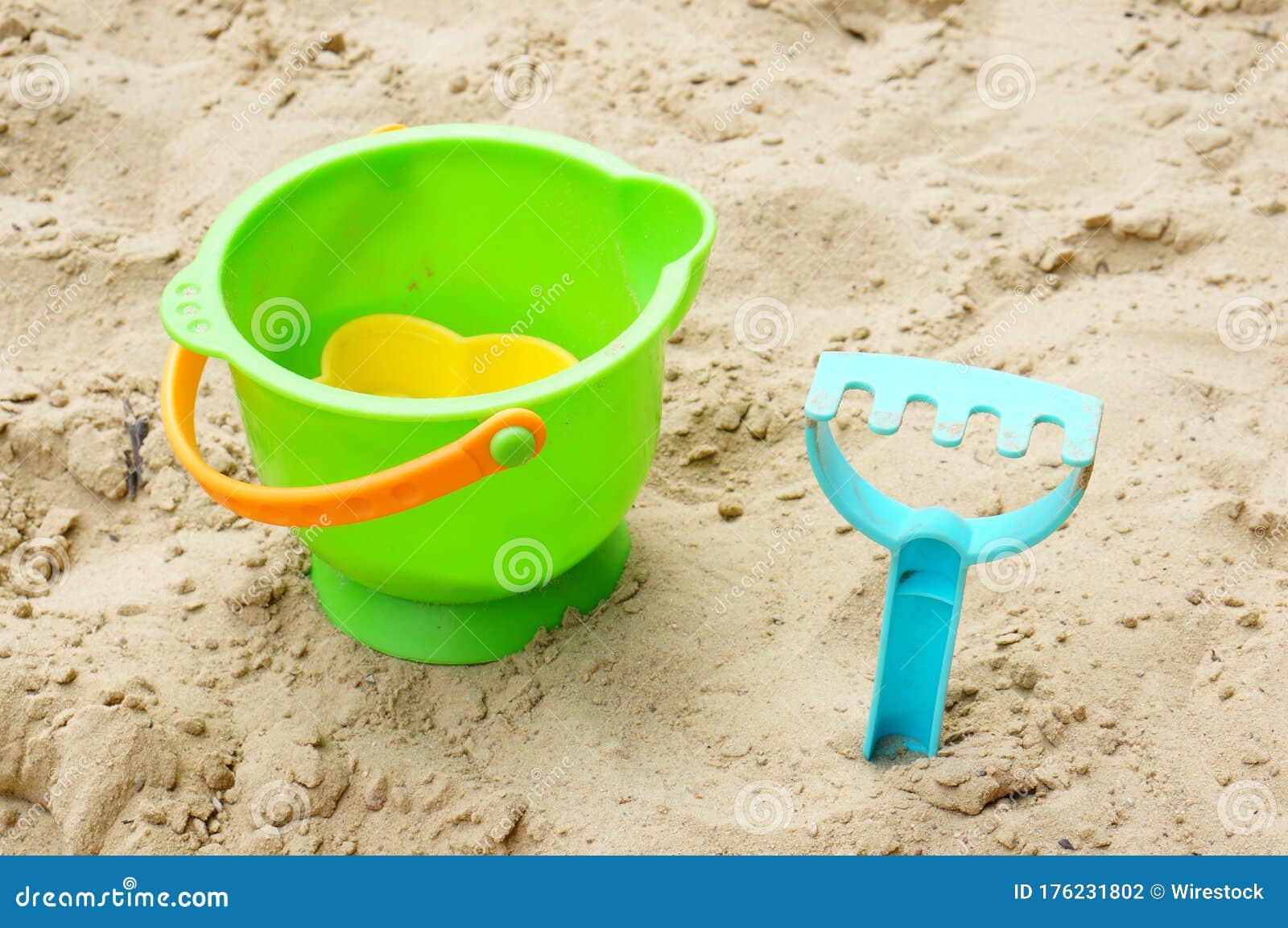 Sand Pit With Rake Stock Image | CartoonDealer.com #4082551