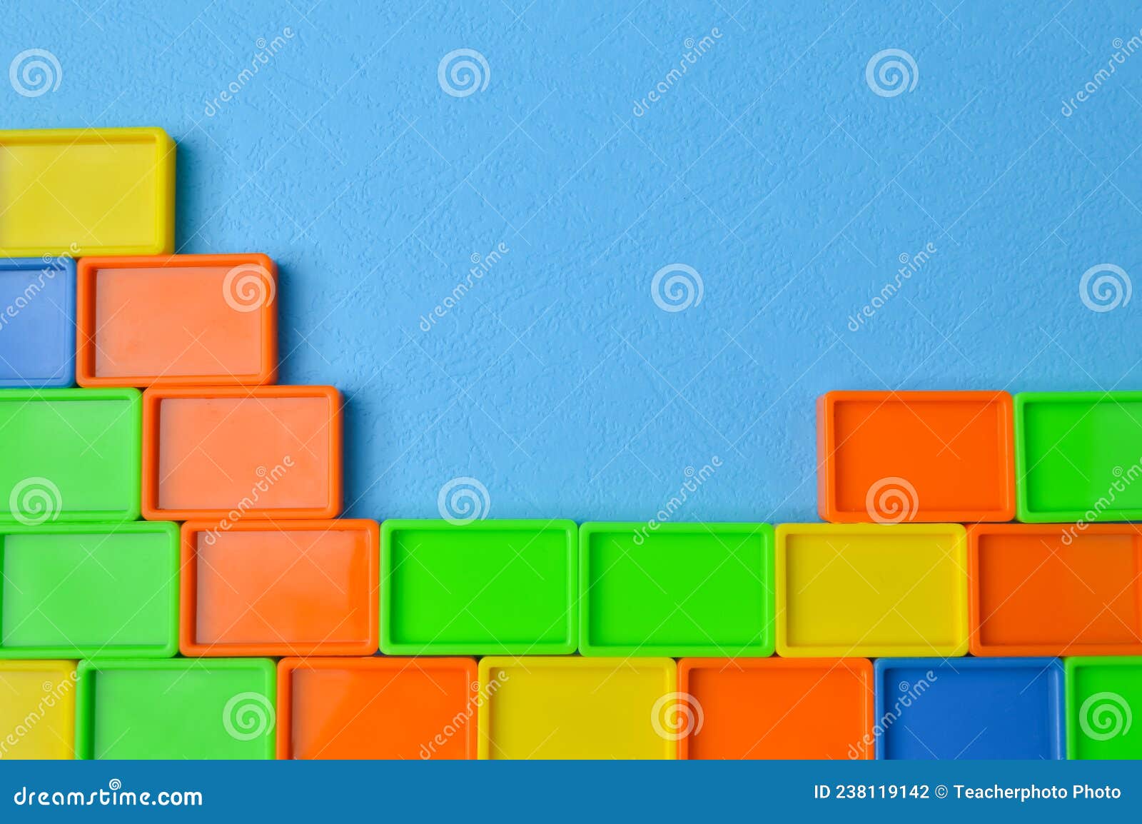 Plastic Toy Building Blocks Isolated on a Blue Background Stock Photo ...