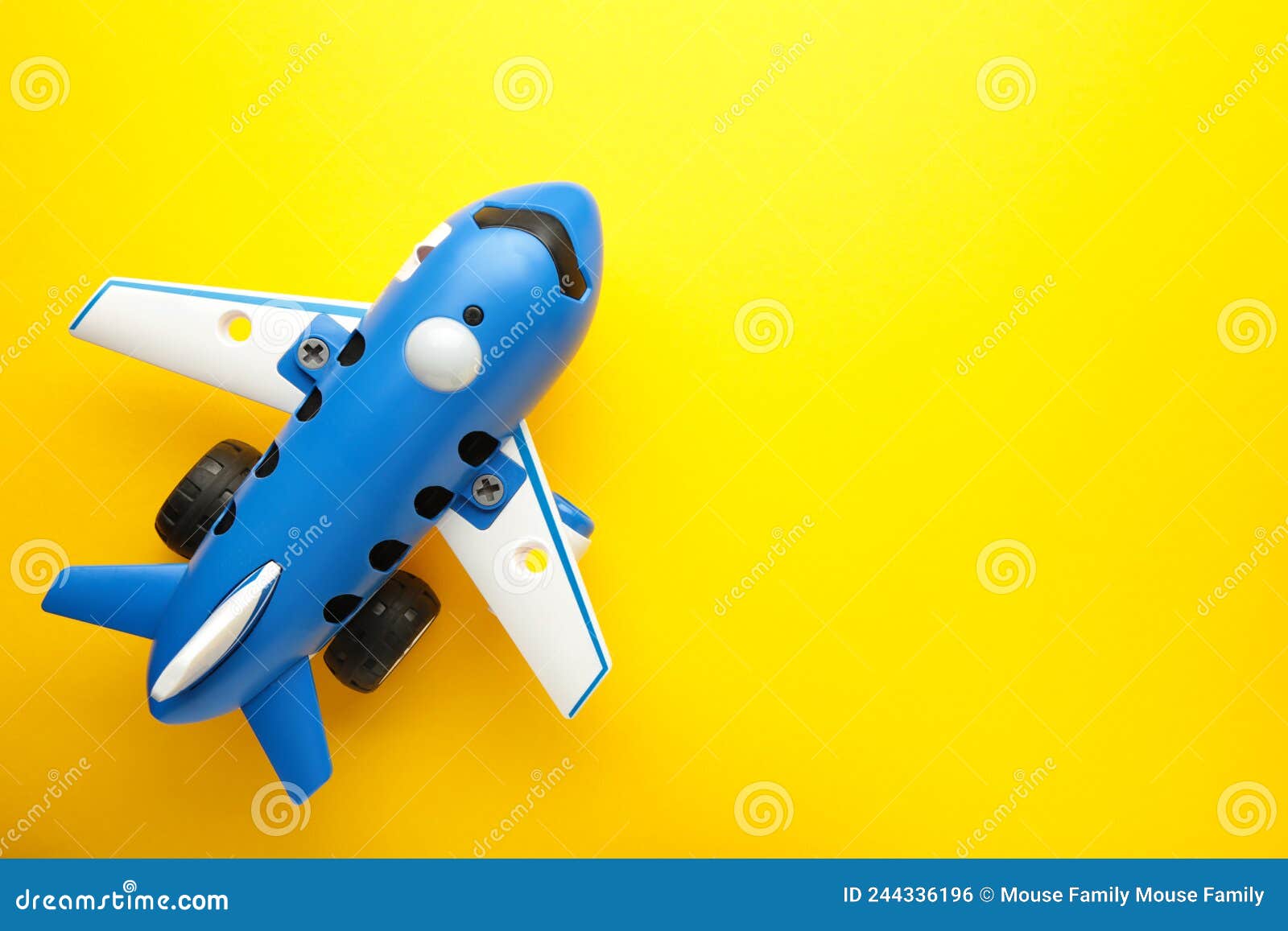 Plastic Toy Plane on Yellow Background with Space for Text Stock Photo ...
