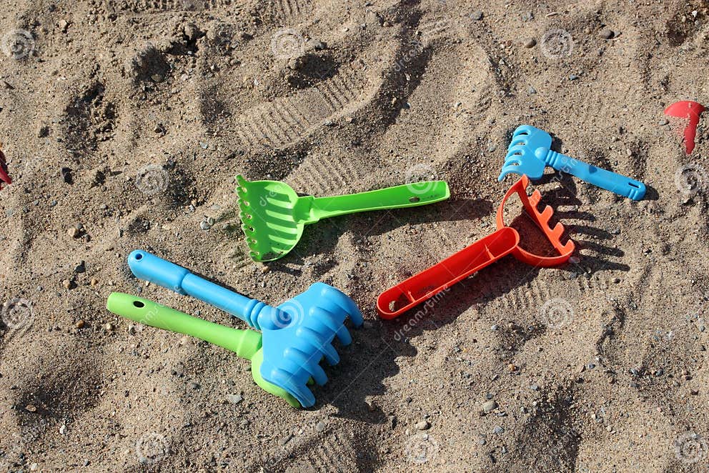 Plastic Toy Rake in the Sand Stock Photo - Image of concept, holiday ...