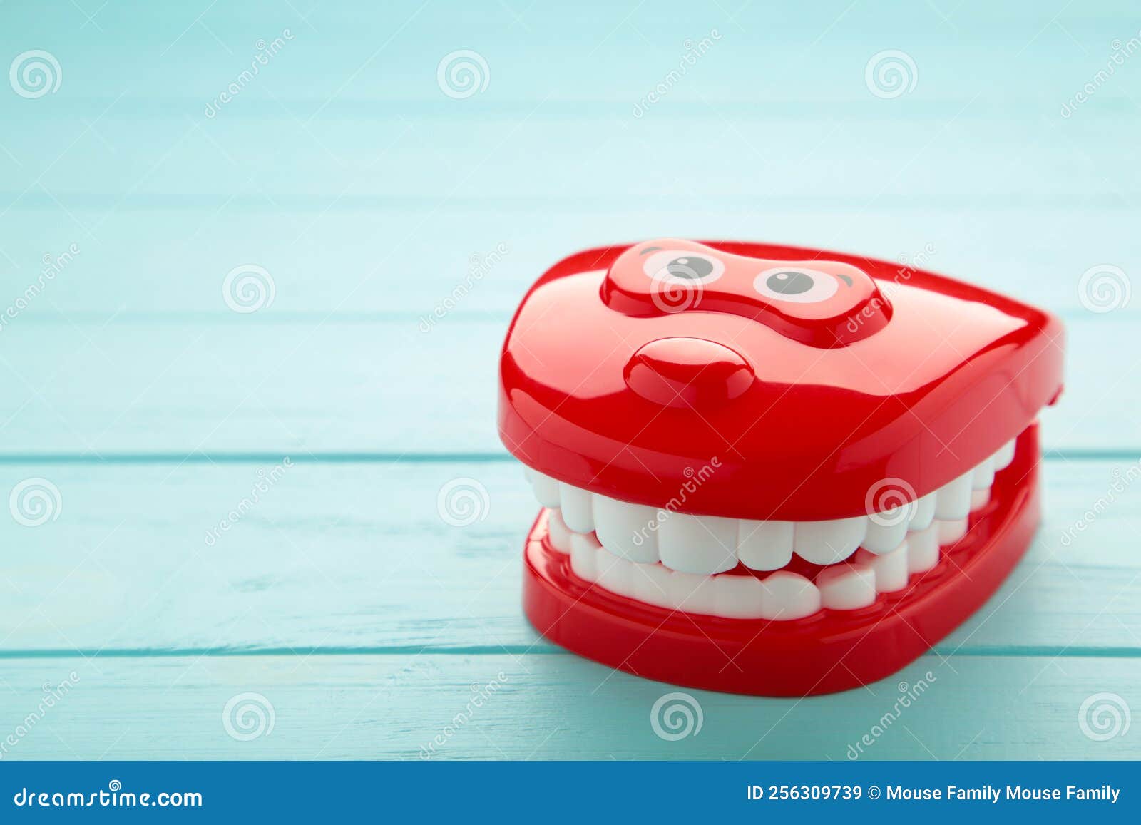 Plastic Toy Teeth on Blue Background. Abstract Minimal Composition ...