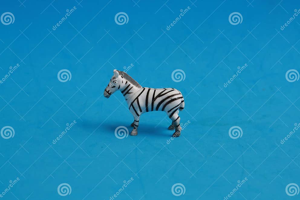 Plastic Toy with Zebra Shape in Color Background Stock Photo - Image of ...