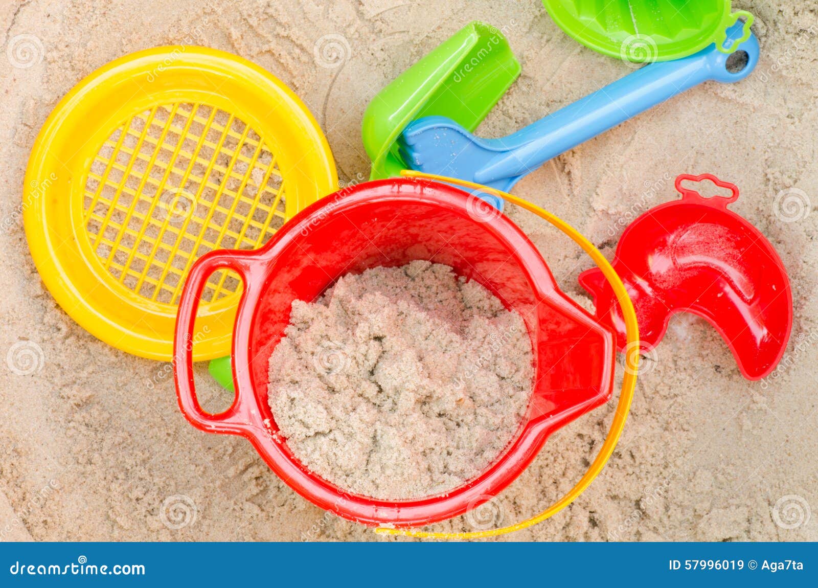 Plastic toys in sandpit stock image. Image of children - 57996019