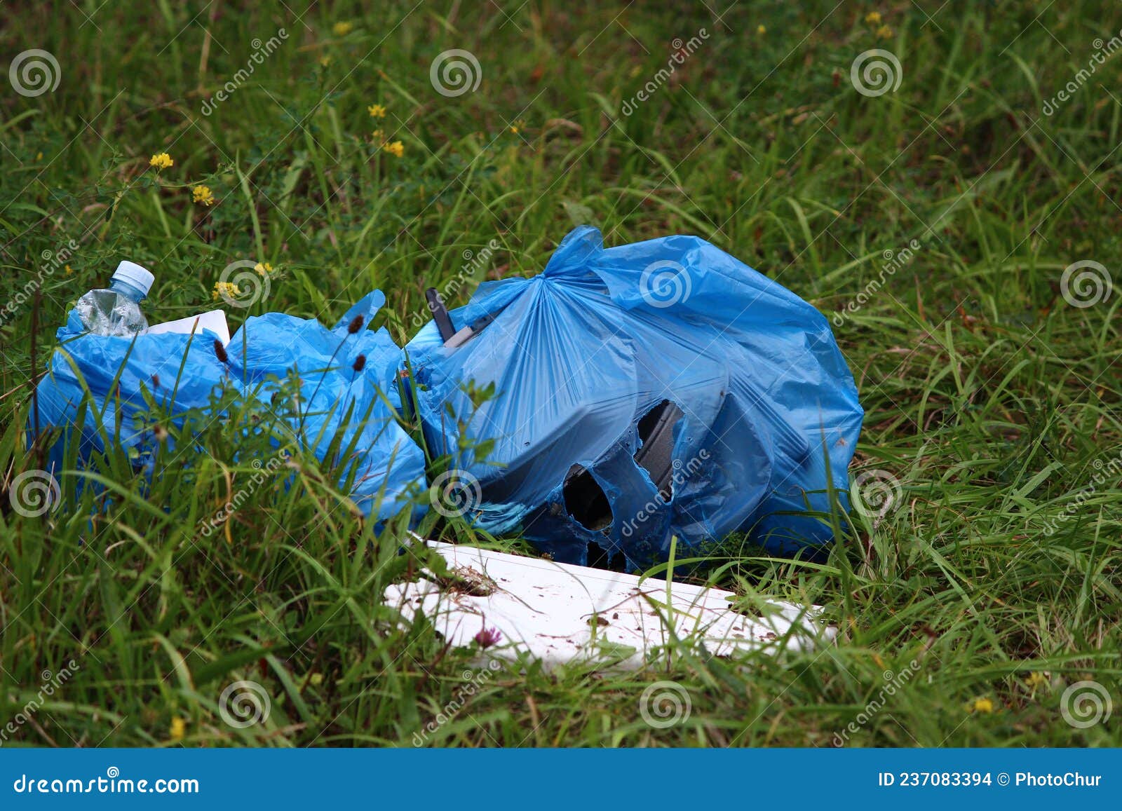 Plastic Trash in Plastic Bags Thrown on the Grass Stock Photo - Image ...